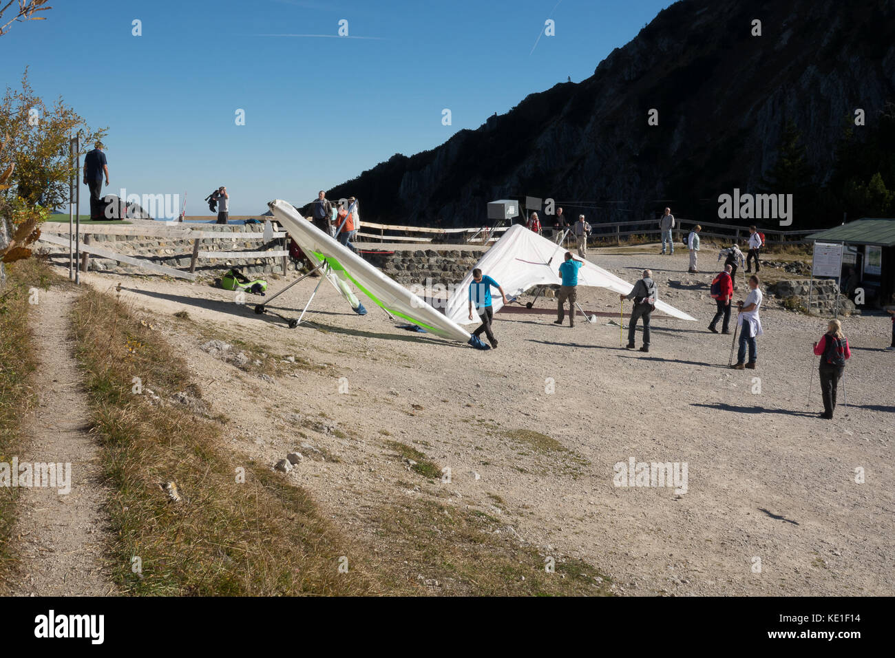Hang glider prepares for take-off with tightening, stretching ...