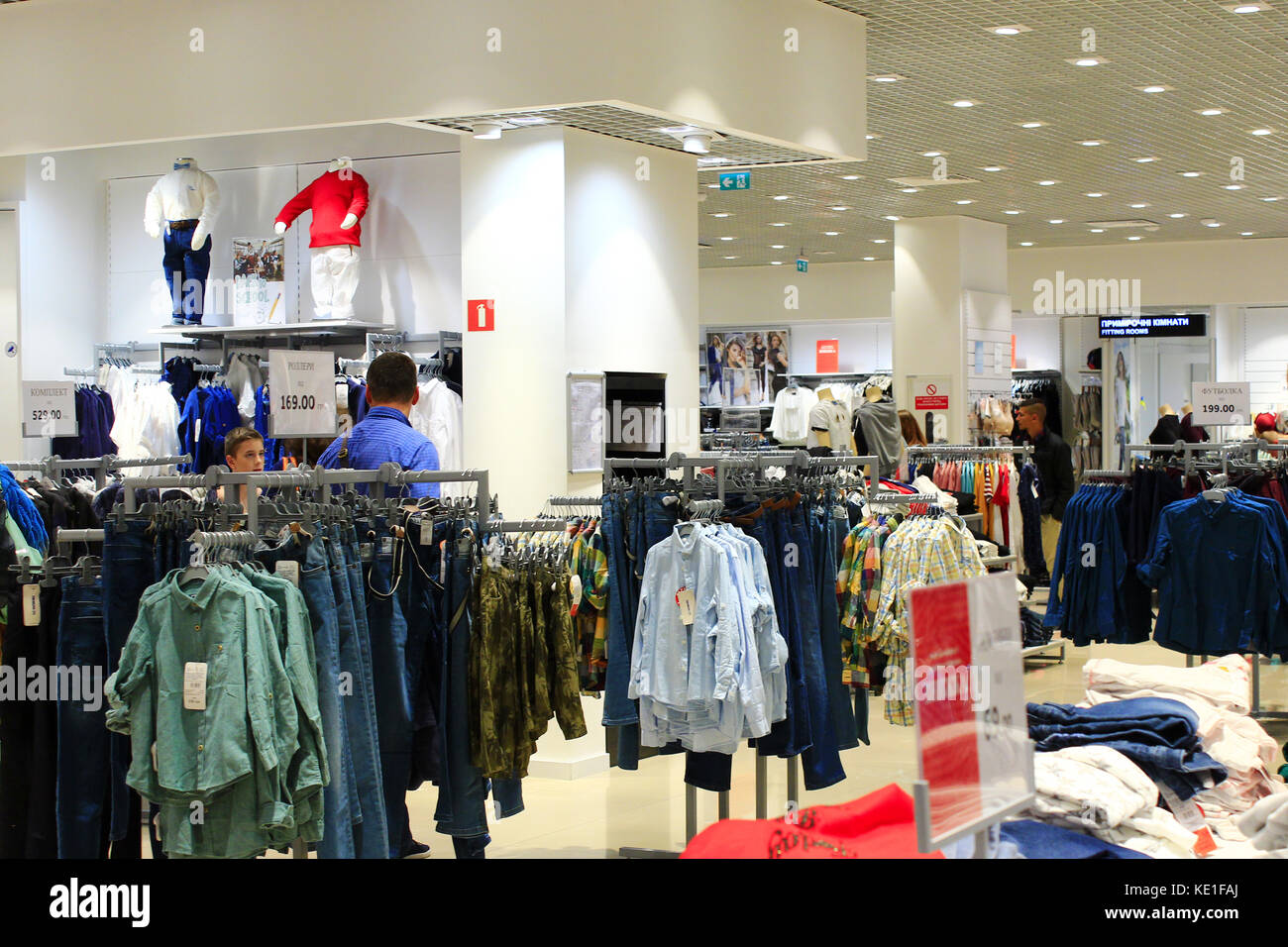 great assortment of goods in clothing store Stock Photo - Alamy