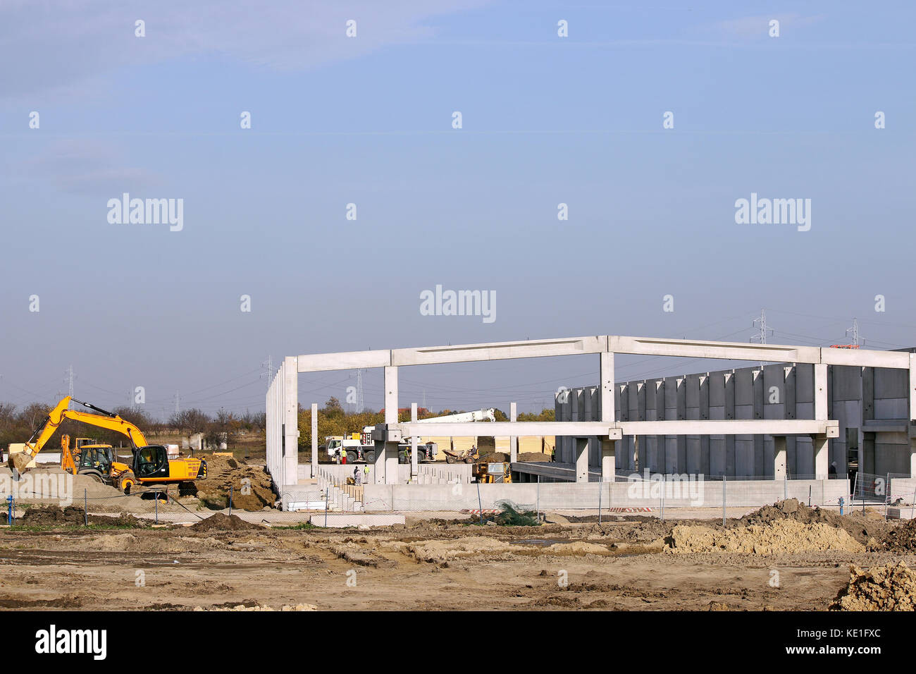 new factory construction site with workers and machinery Stock Photo ...