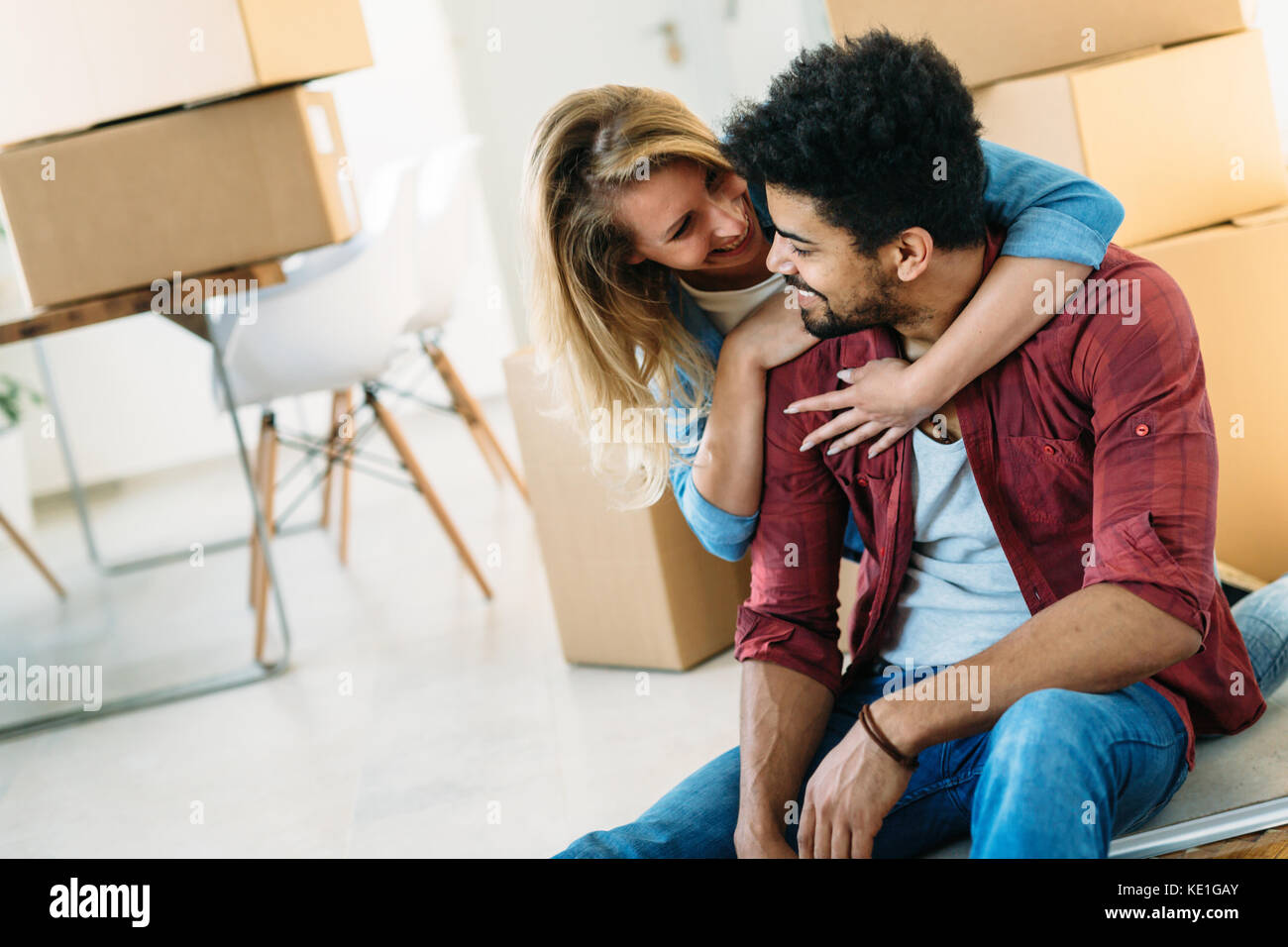 home, people, moving and real estate concept - happy couple having fun ...