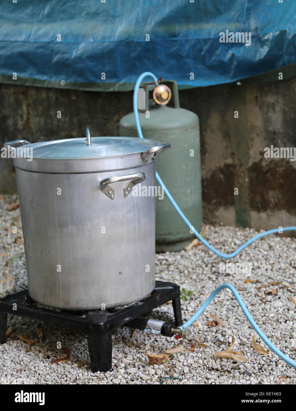 Big aluminum pot with gas canister in the camp kitchen while preparing ...