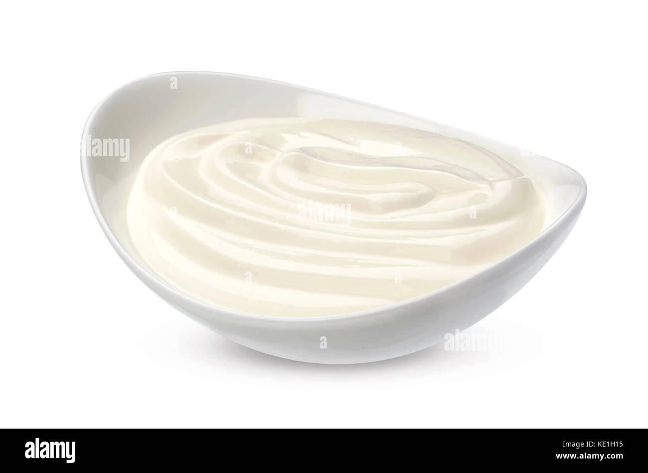 Sour cream in bowl isolated on white background Stock Photo - Alamy
