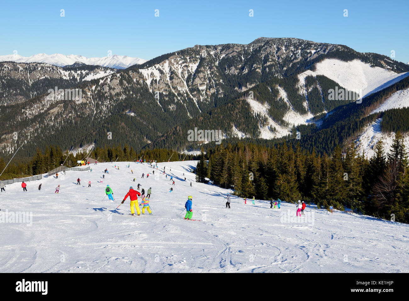 JASNA, SLOVAKIA - JANUARY 22: The skiers and snowborders are on slope ...