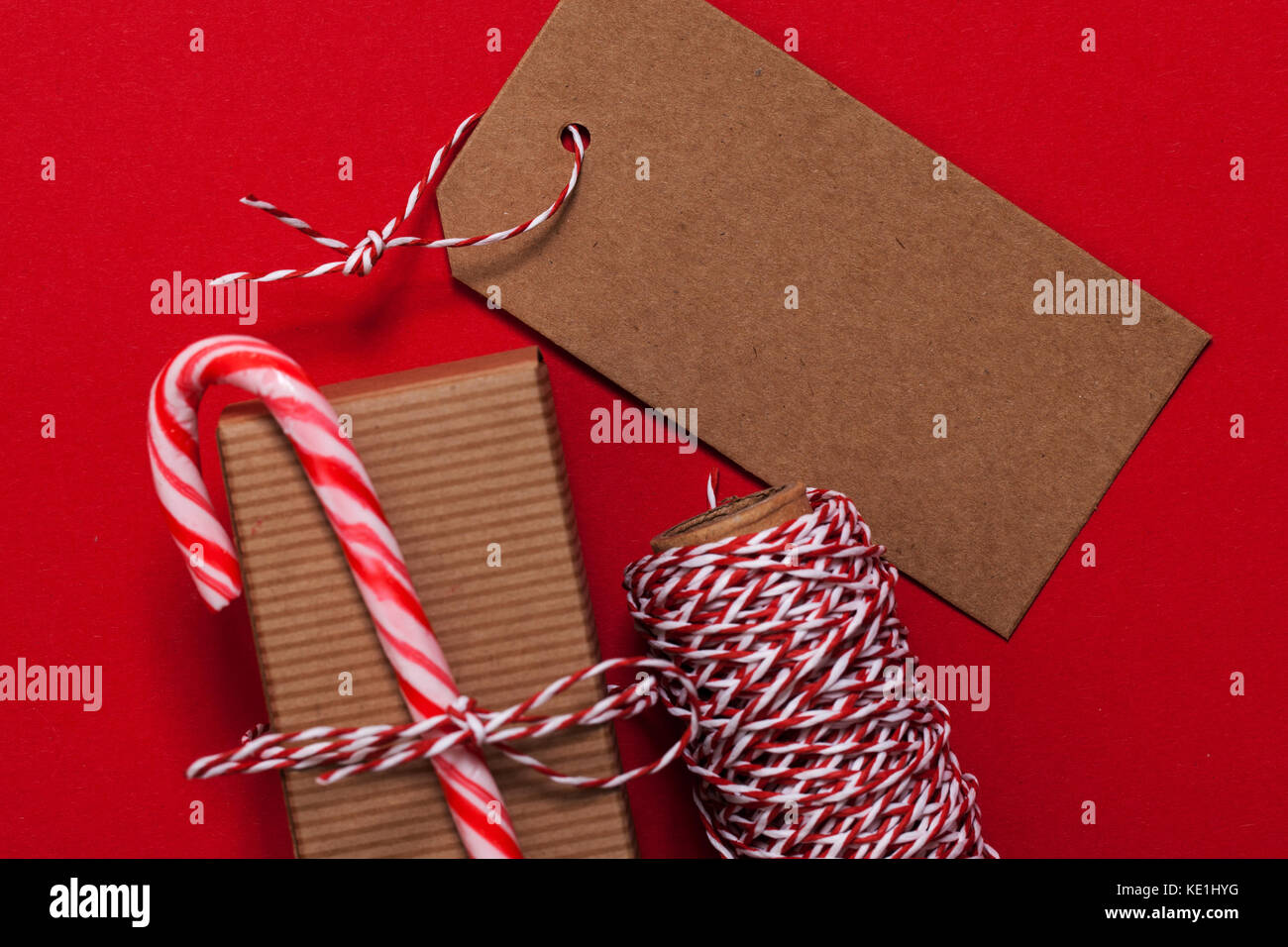 Festive Christmas present with candy cane on a red background Stock ...