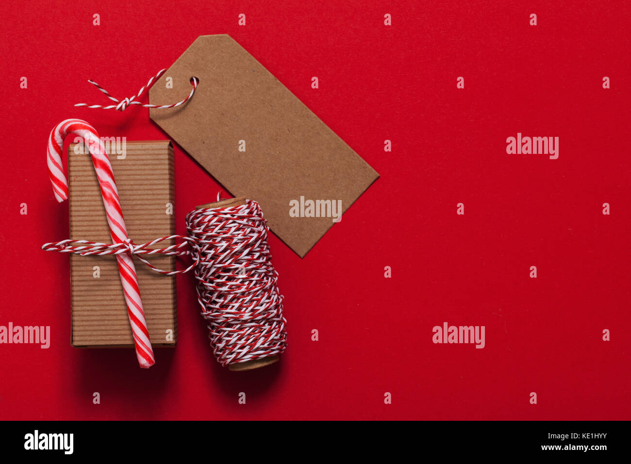 Festive Christmas present with candy cane on a red background Stock ...