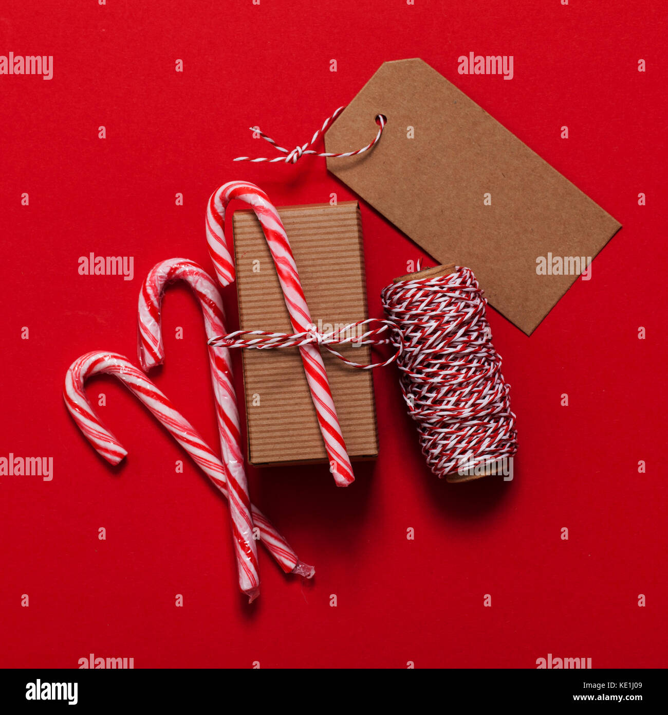 Festive Christmas present with candy cane on a red background Stock ...