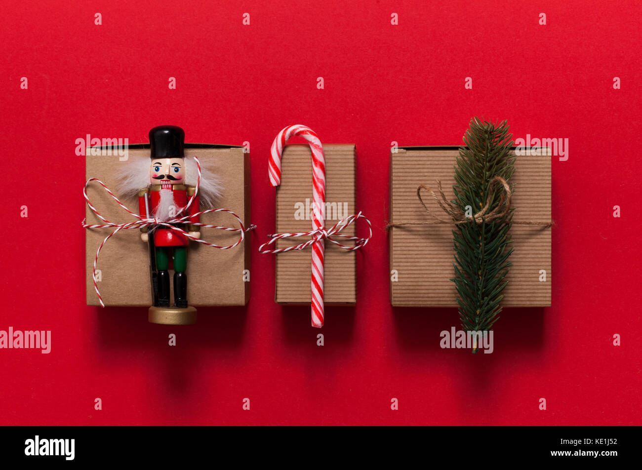 Festive Christmas presents on a red background Stock Photo - Alamy