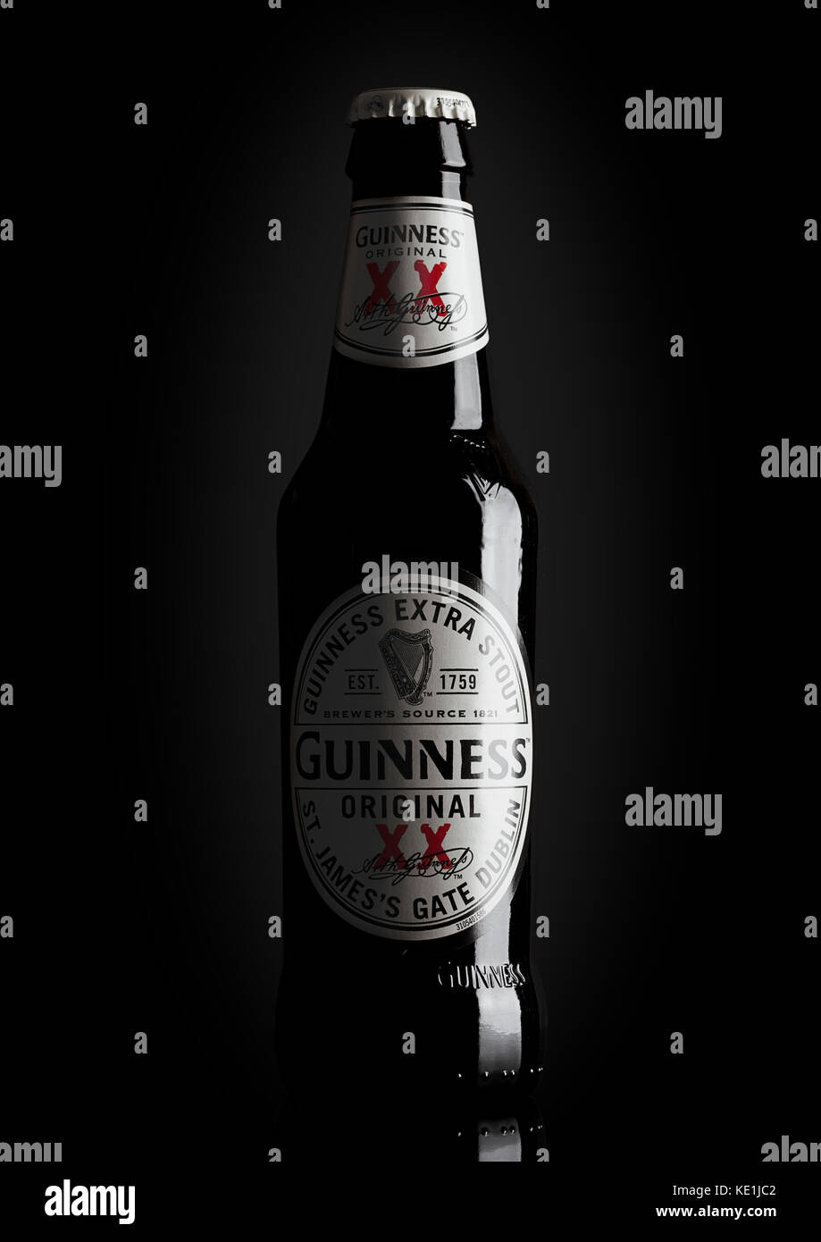 LONDON, UK - OCTOBER 15, 2017: Guinness extra stout beer bottle on ...