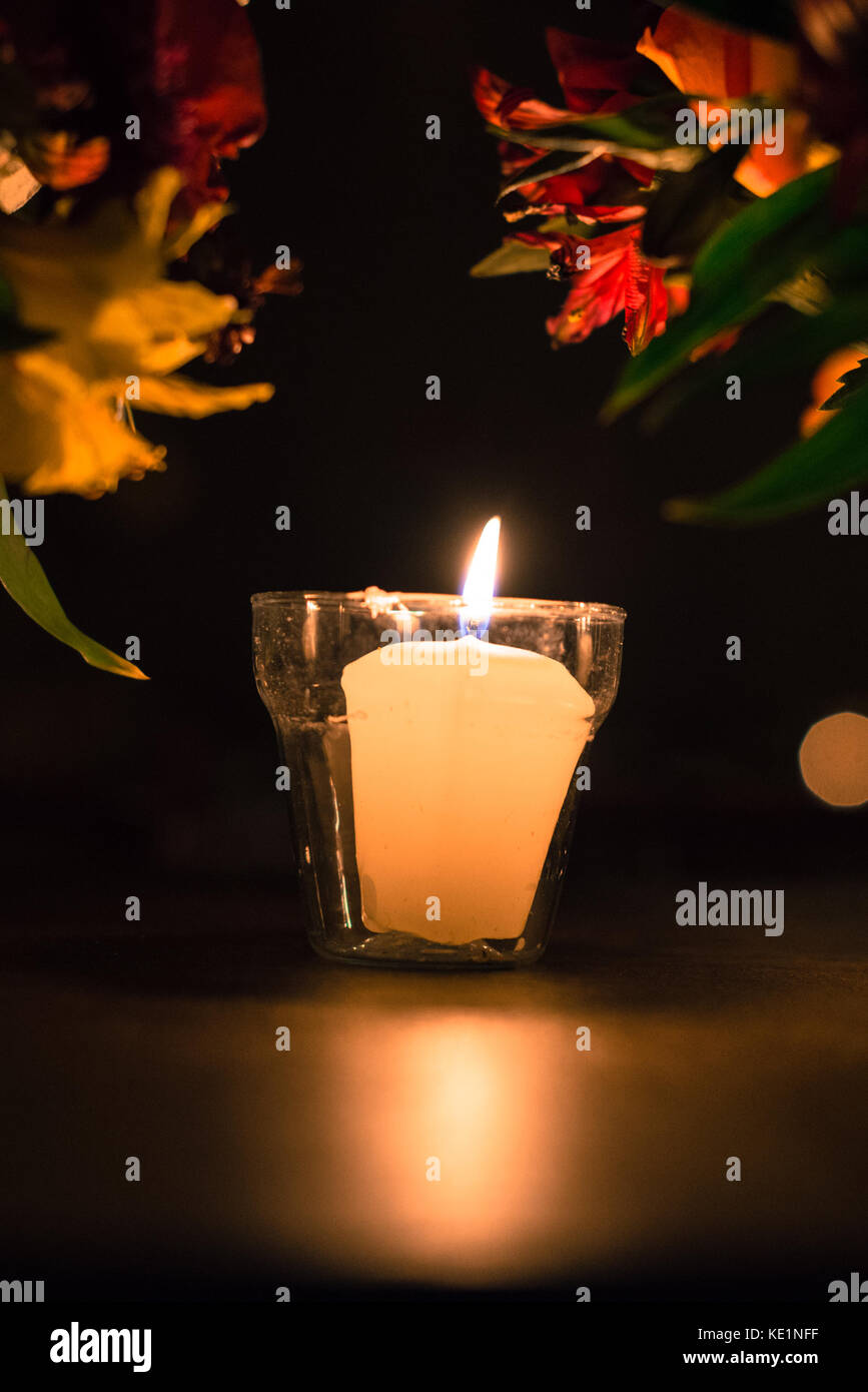 Horizontal picture of lit candles and flowers as decoration for a ...