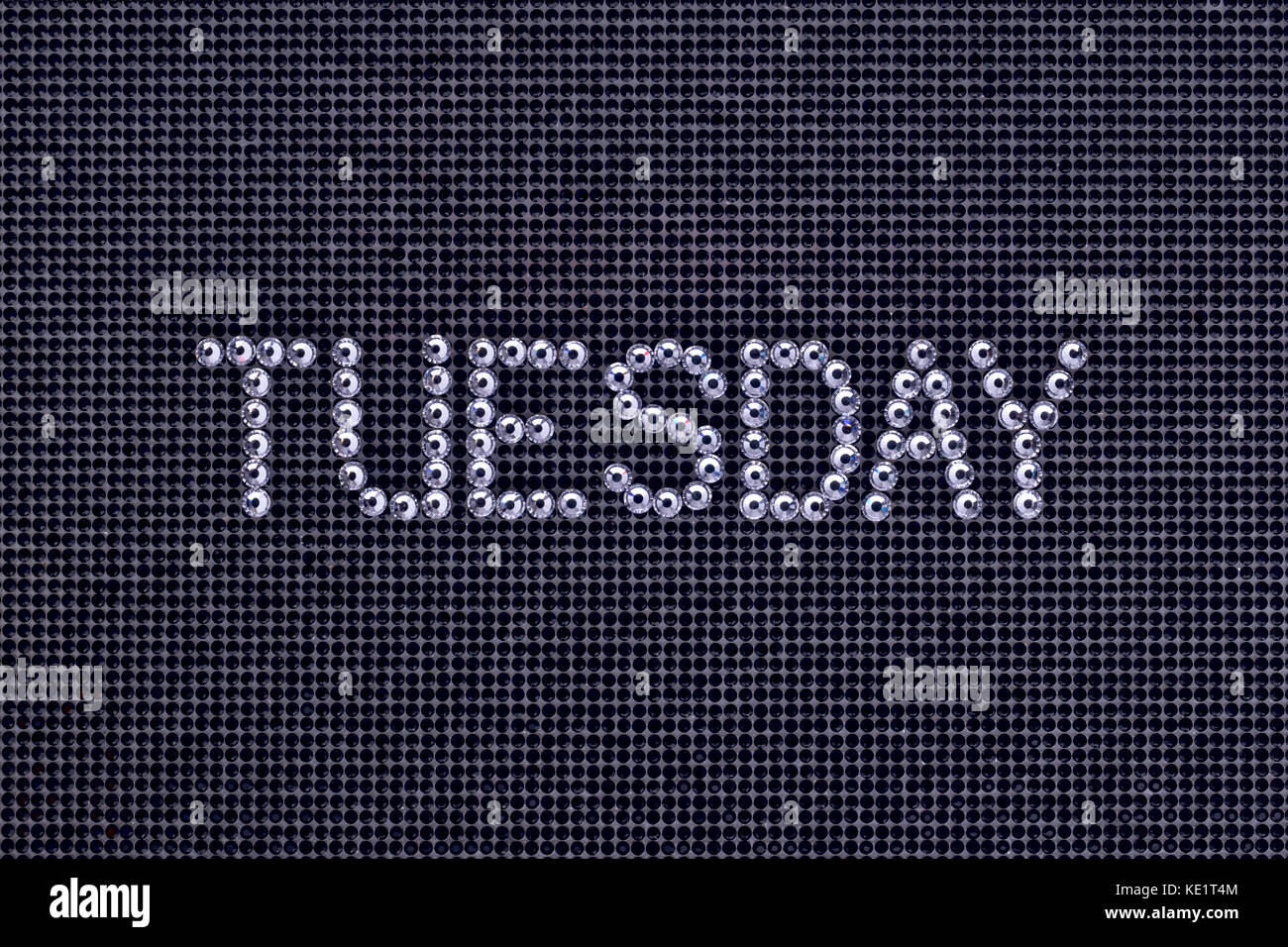 Day of the week, word TUESDAY is made rhinestones crystal color on a ...