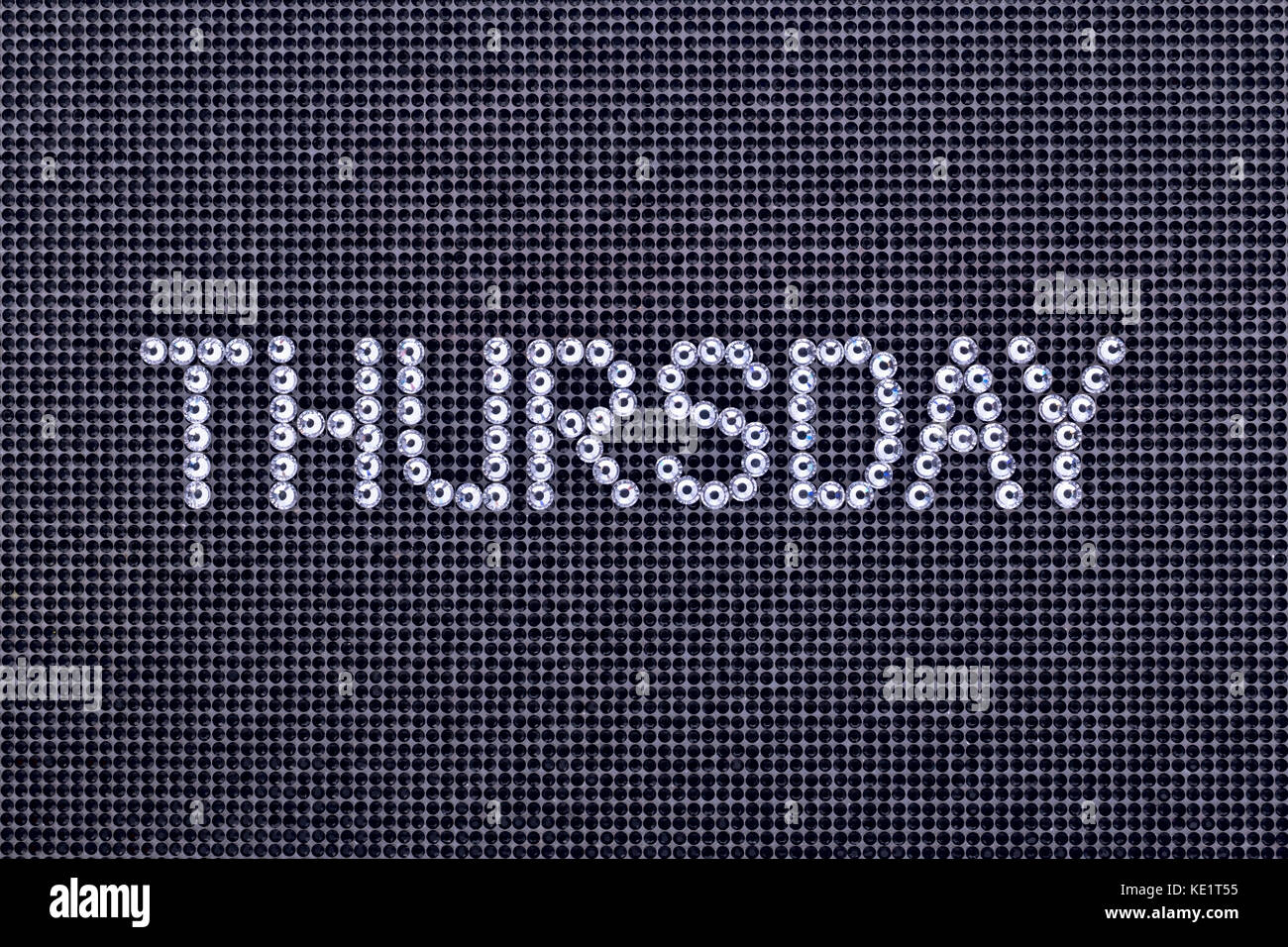 Day of the week, word THURSDAY is made rhinestones crystal color on a ...