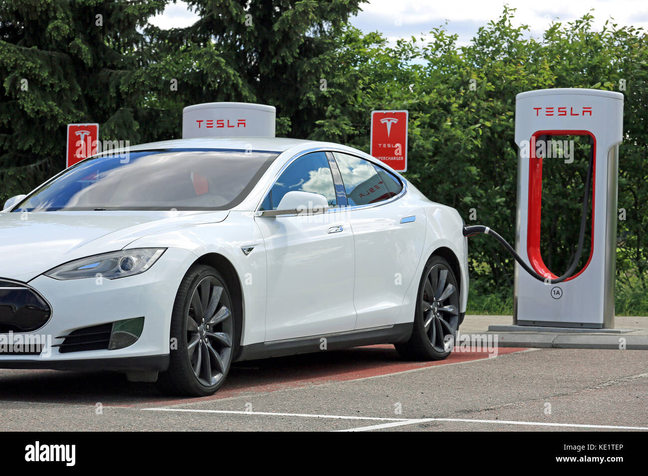PAIMIO, FINLAND - JUNE 4, 2016: White Tesla Model S electric car is ...