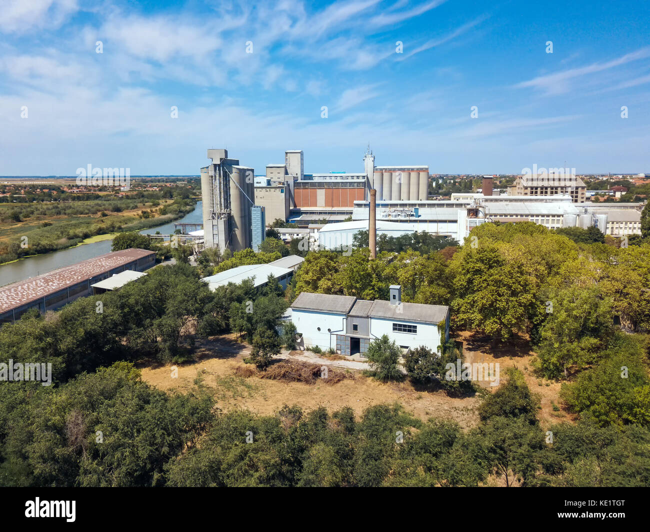 Aerial view of industrial cityscape from drone pov with factory ...