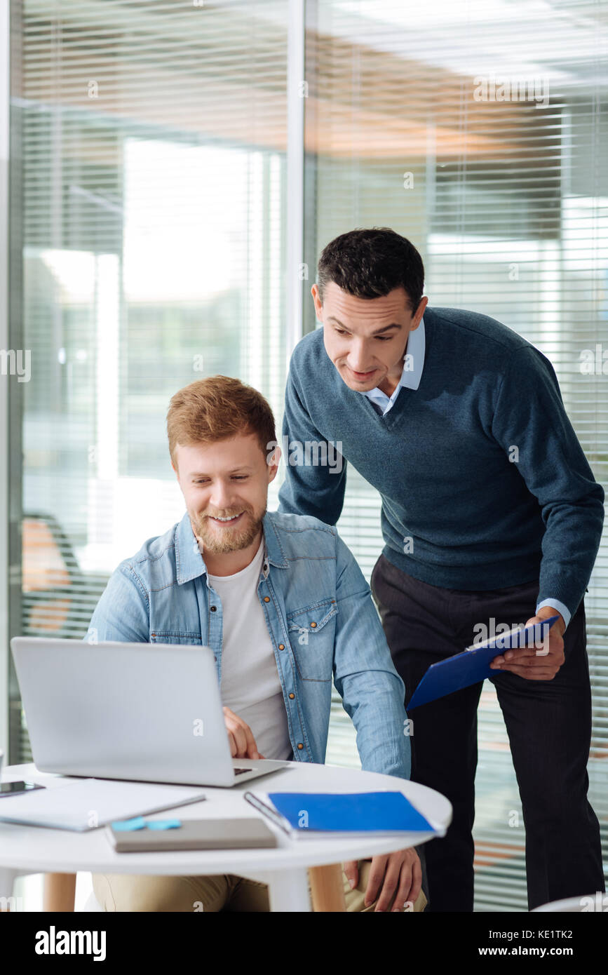 Concentrated colleagues thinking about improvement Stock Photo - Alamy