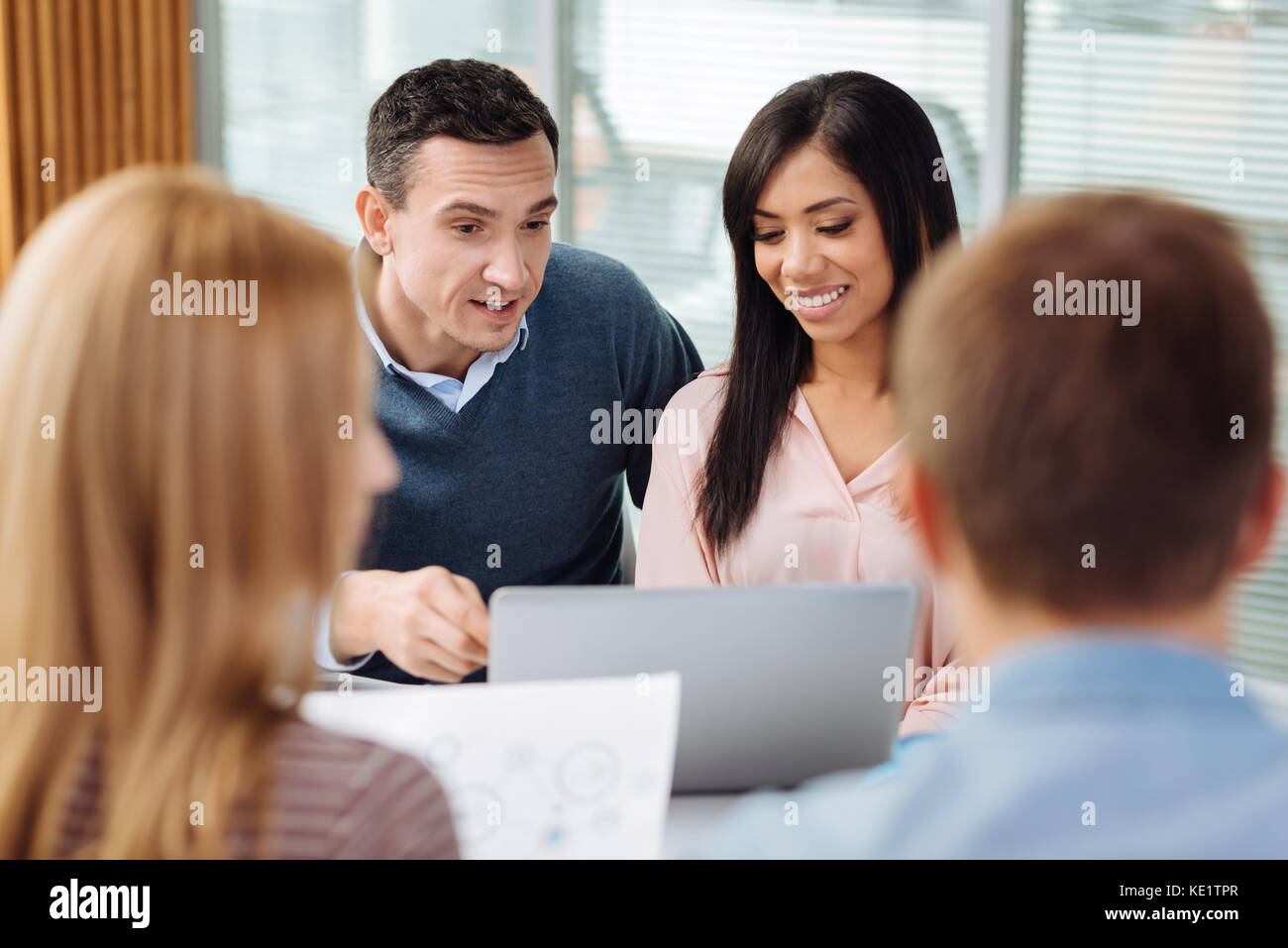 Delighted people discussing their program Stock Photo - Alamy