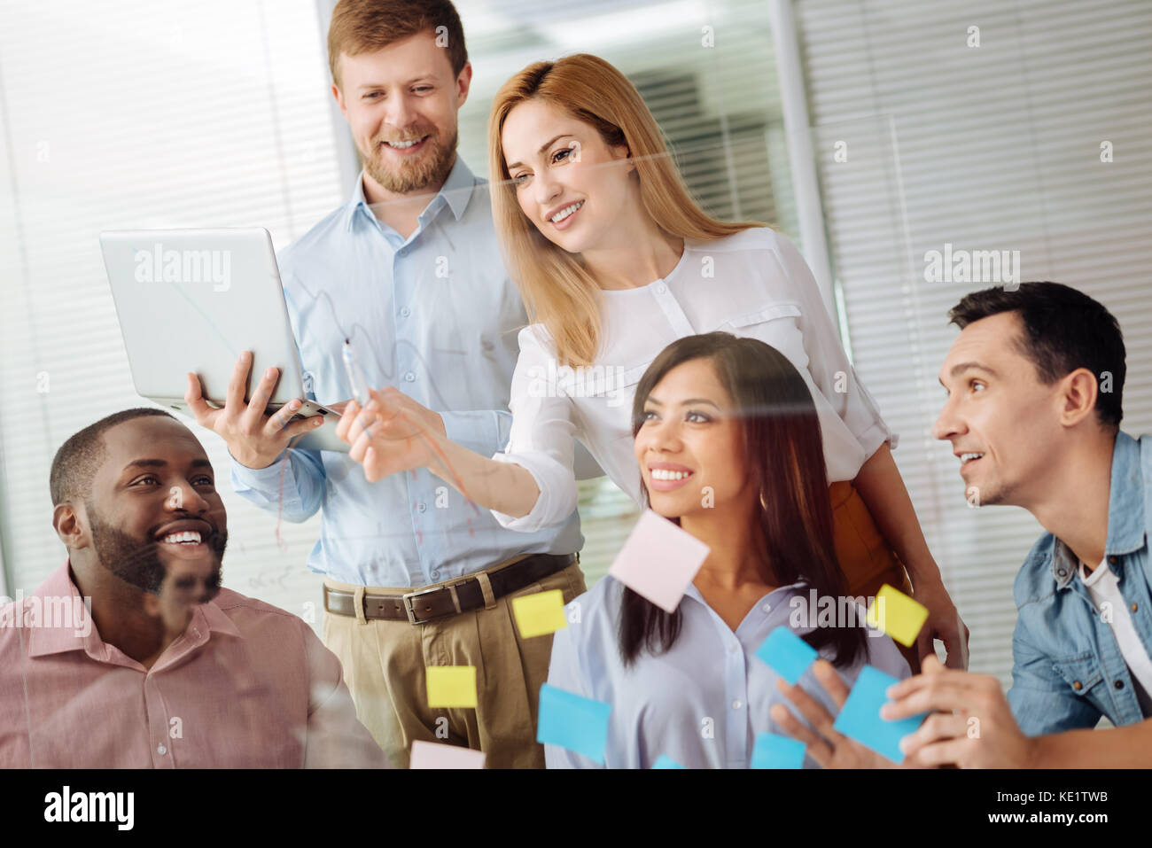 Busy friends thinking of their company Stock Photo - Alamy