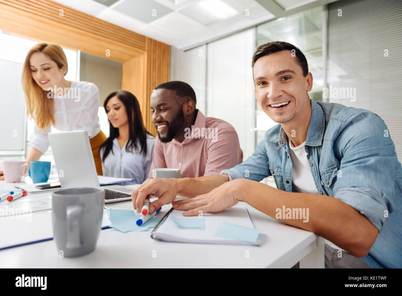 Smiling male person looking at camera Stock Photo - Alamy