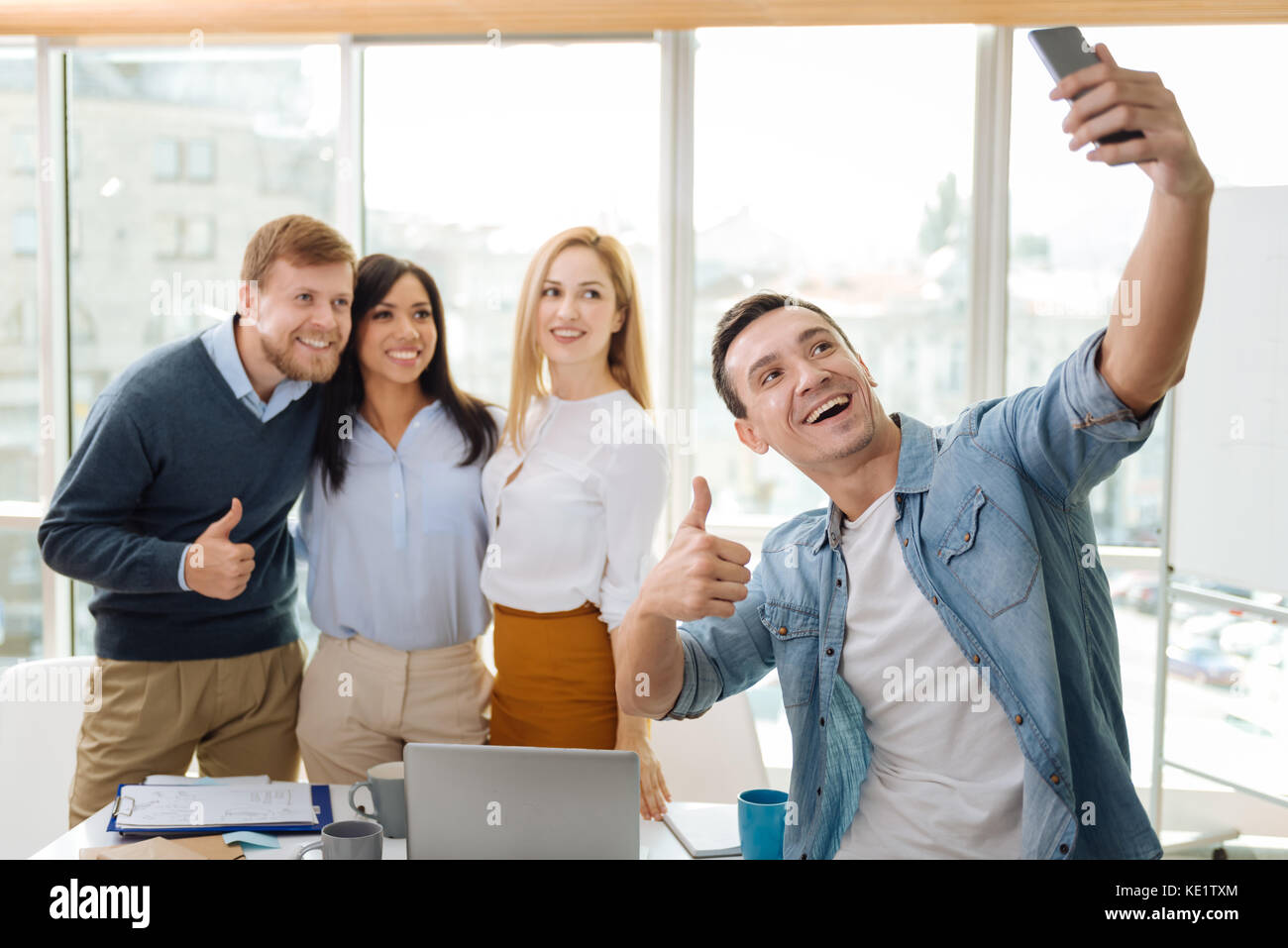 Delighted people posing on selfie camera Stock Photo - Alamy