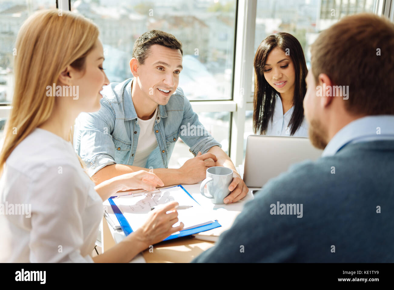 Experienced worker consulting his partners Stock Photo - Alamy