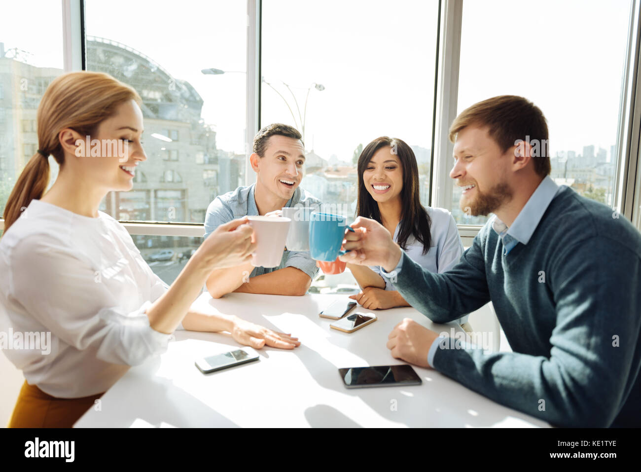 Shy blonde sitting opposite her partner Stock Photo - Alamy