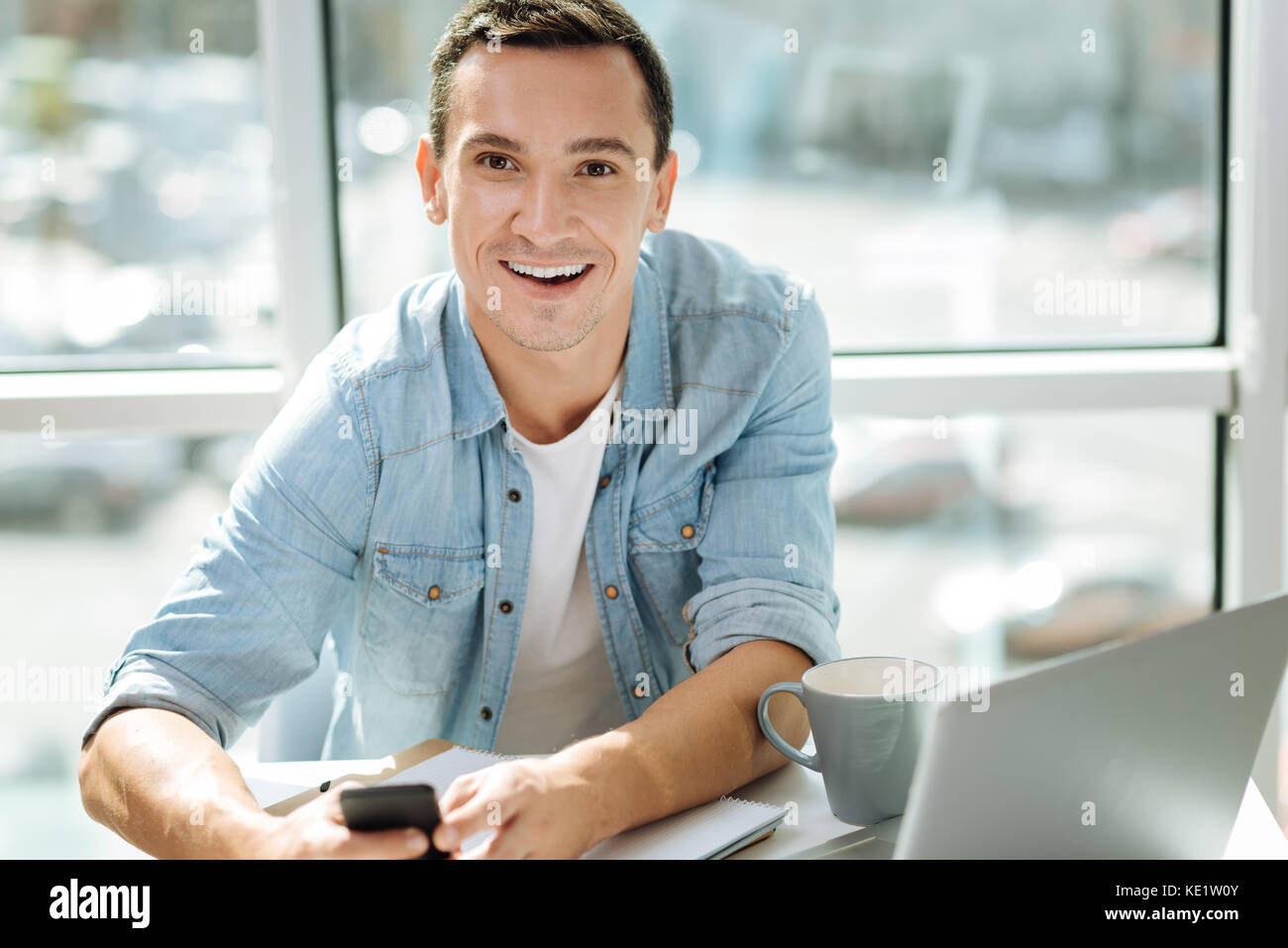 Handsome man looking straight at camera Stock Photo - Alamy