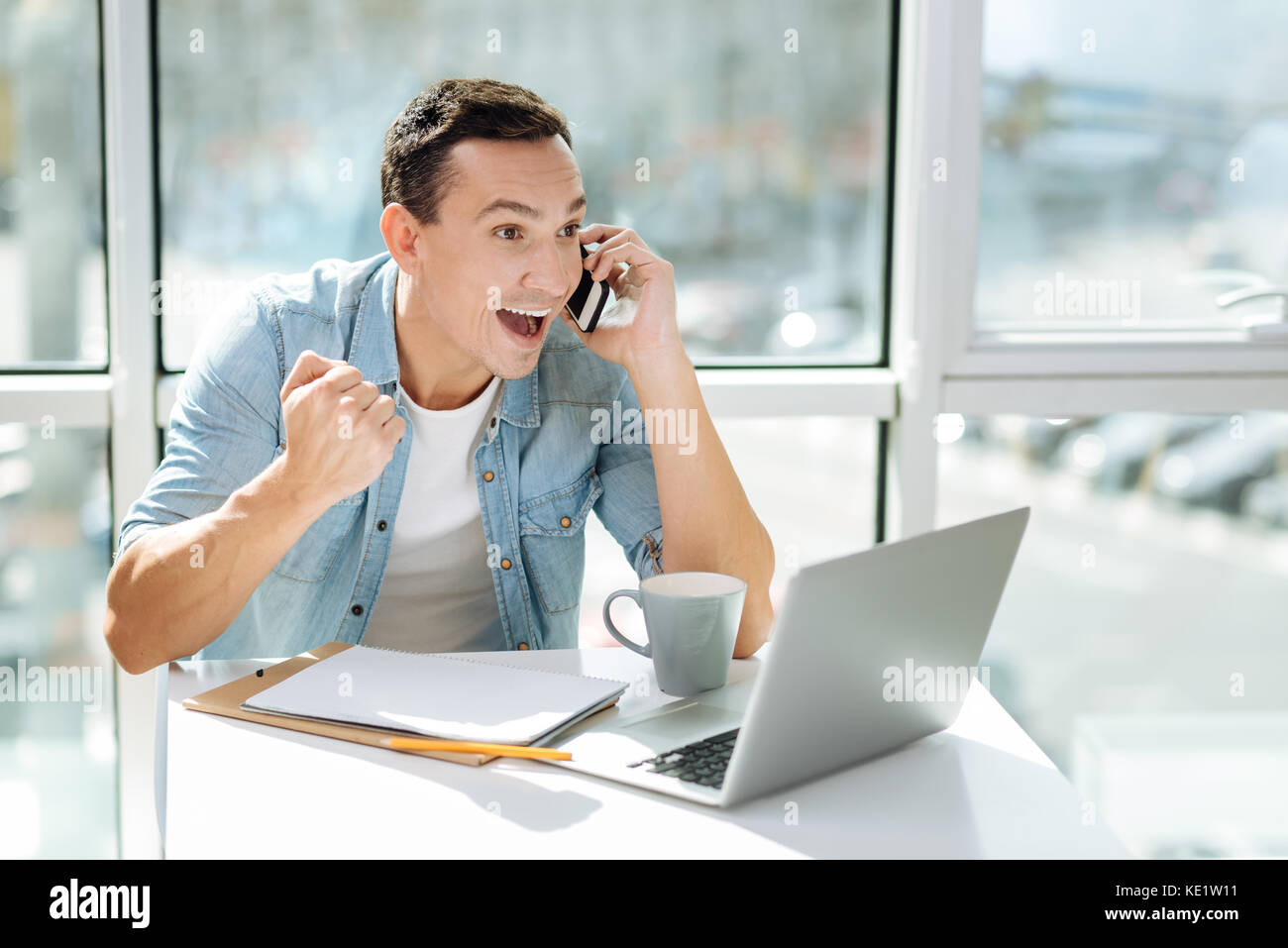 Happy male person expressing his emotions Stock Photo - Alamy