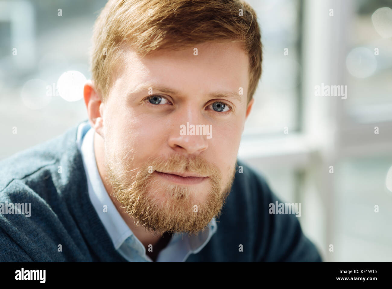Delighted bearded man looking forward Stock Photo - Alamy
