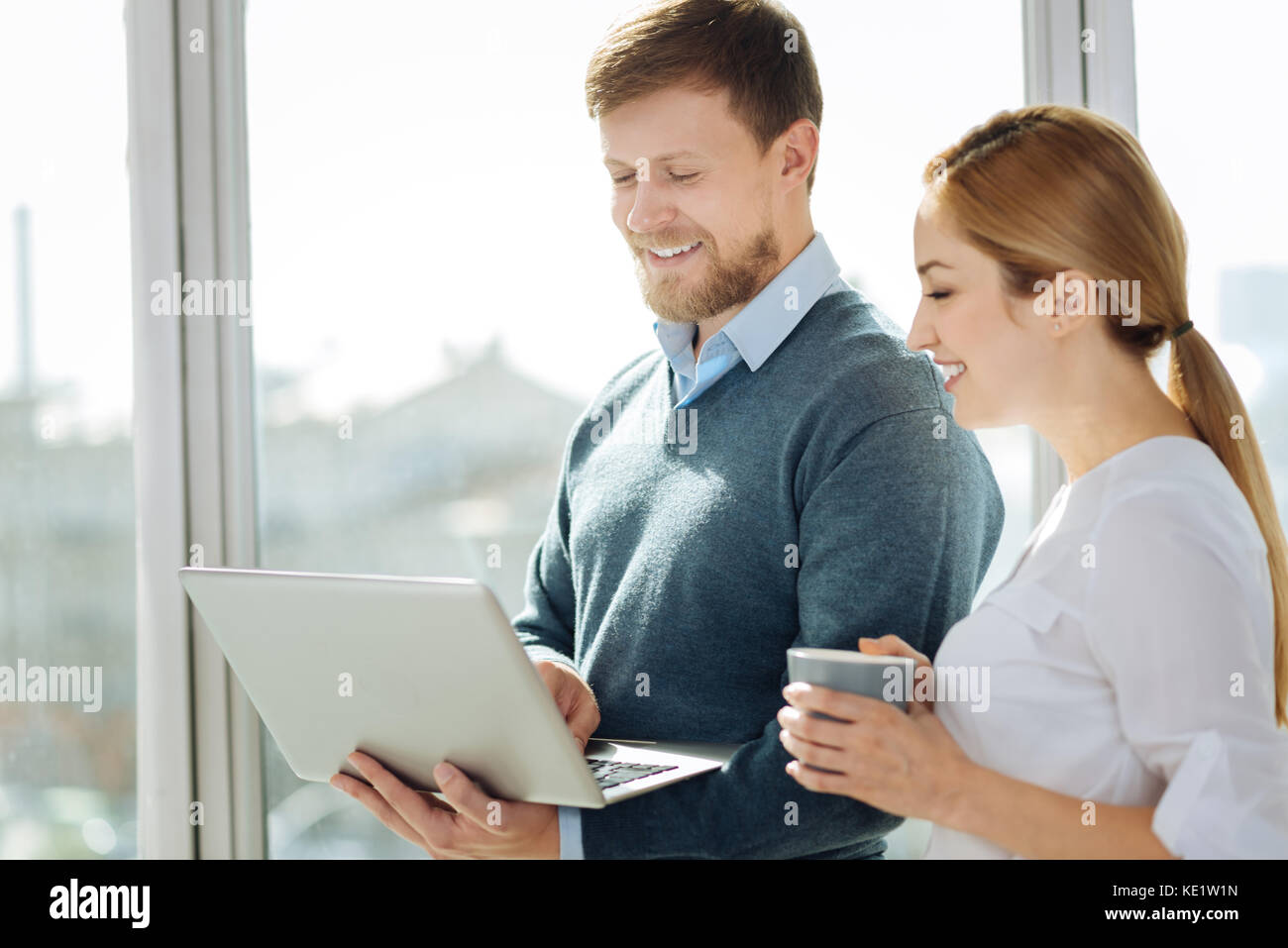 Two colleagues discussing their project Stock Photo - Alamy