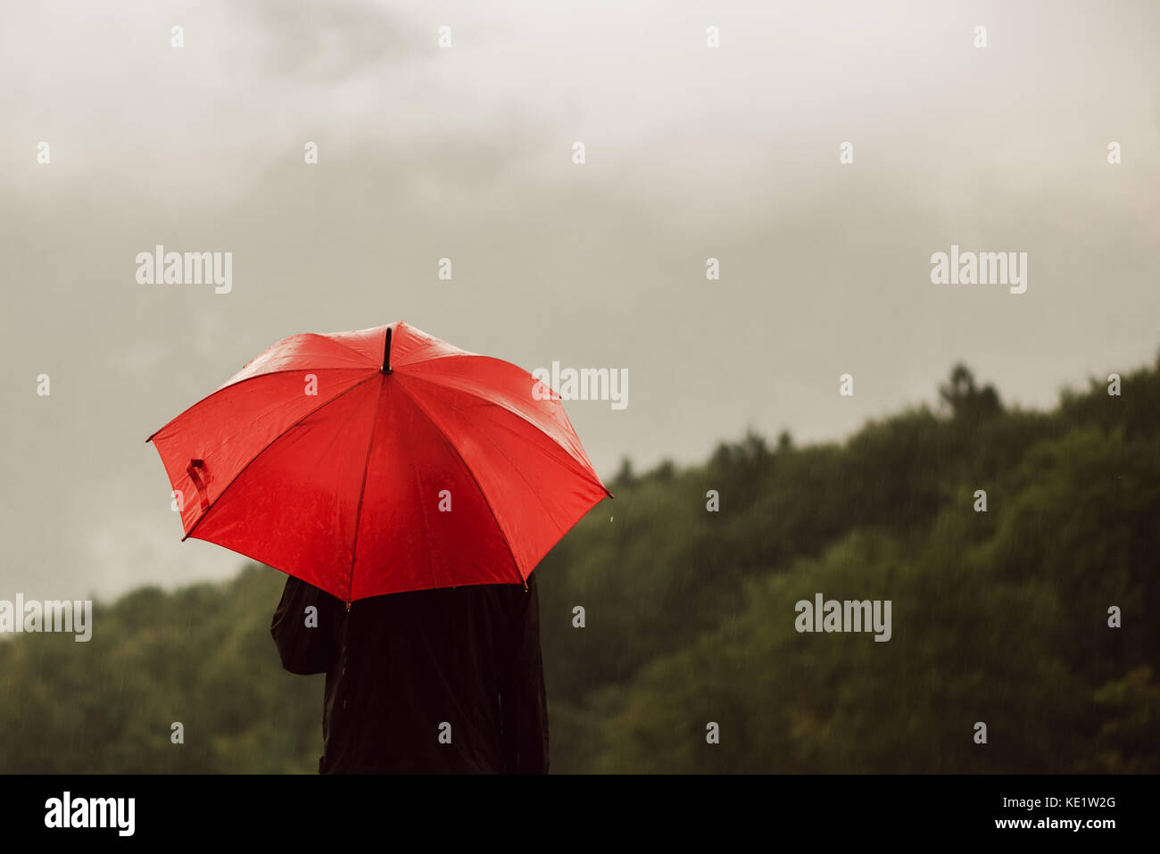 Man standing in rain hi-res stock photography and images - Alamy