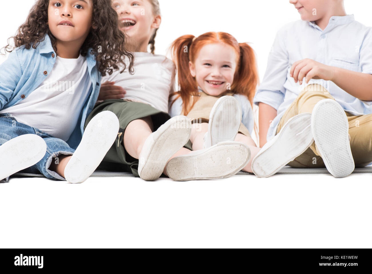 happy multiethnic children sitting together isolated on white Stock ...