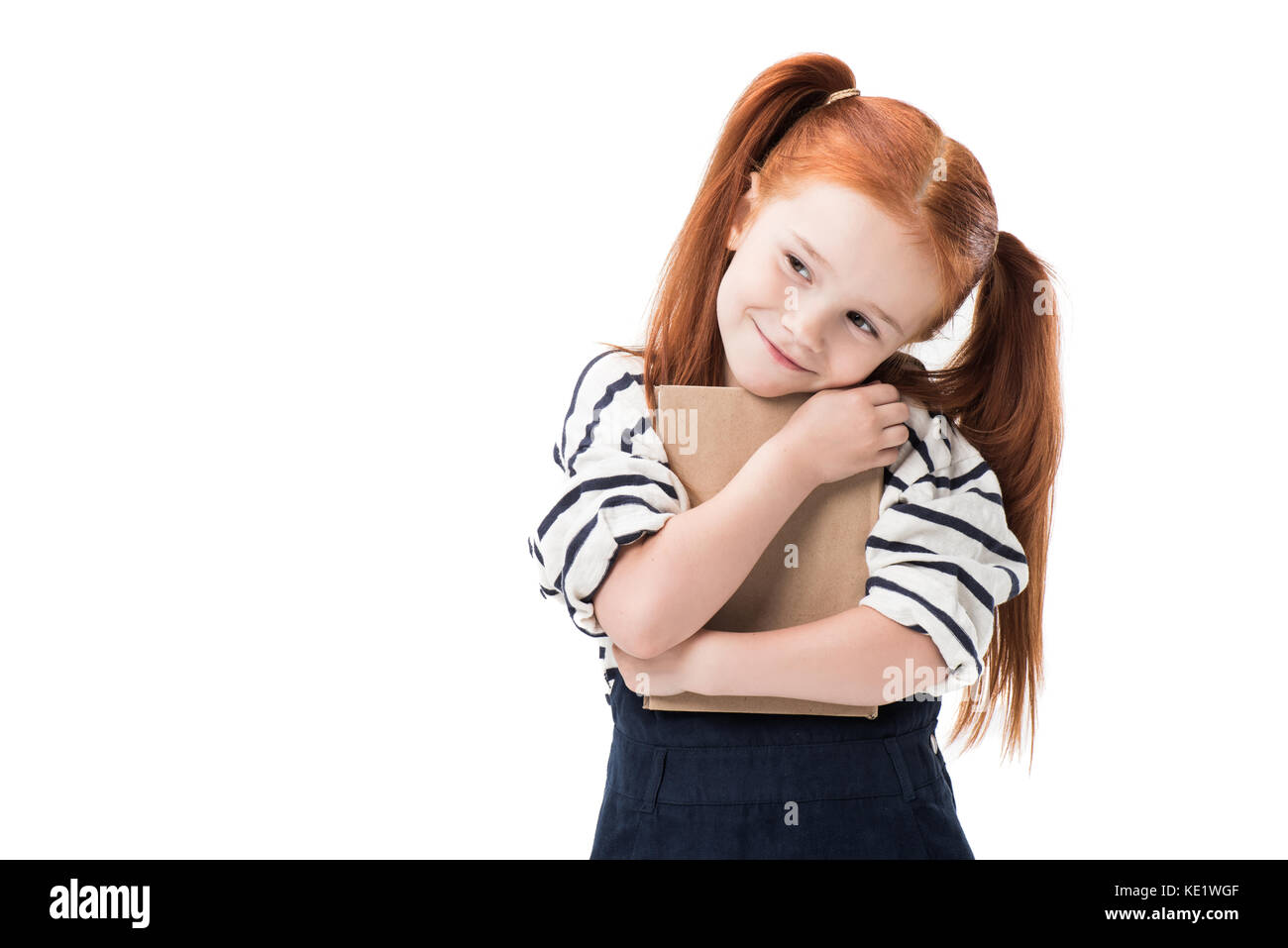 Child hugging book hi-res stock photography and images - Alamy