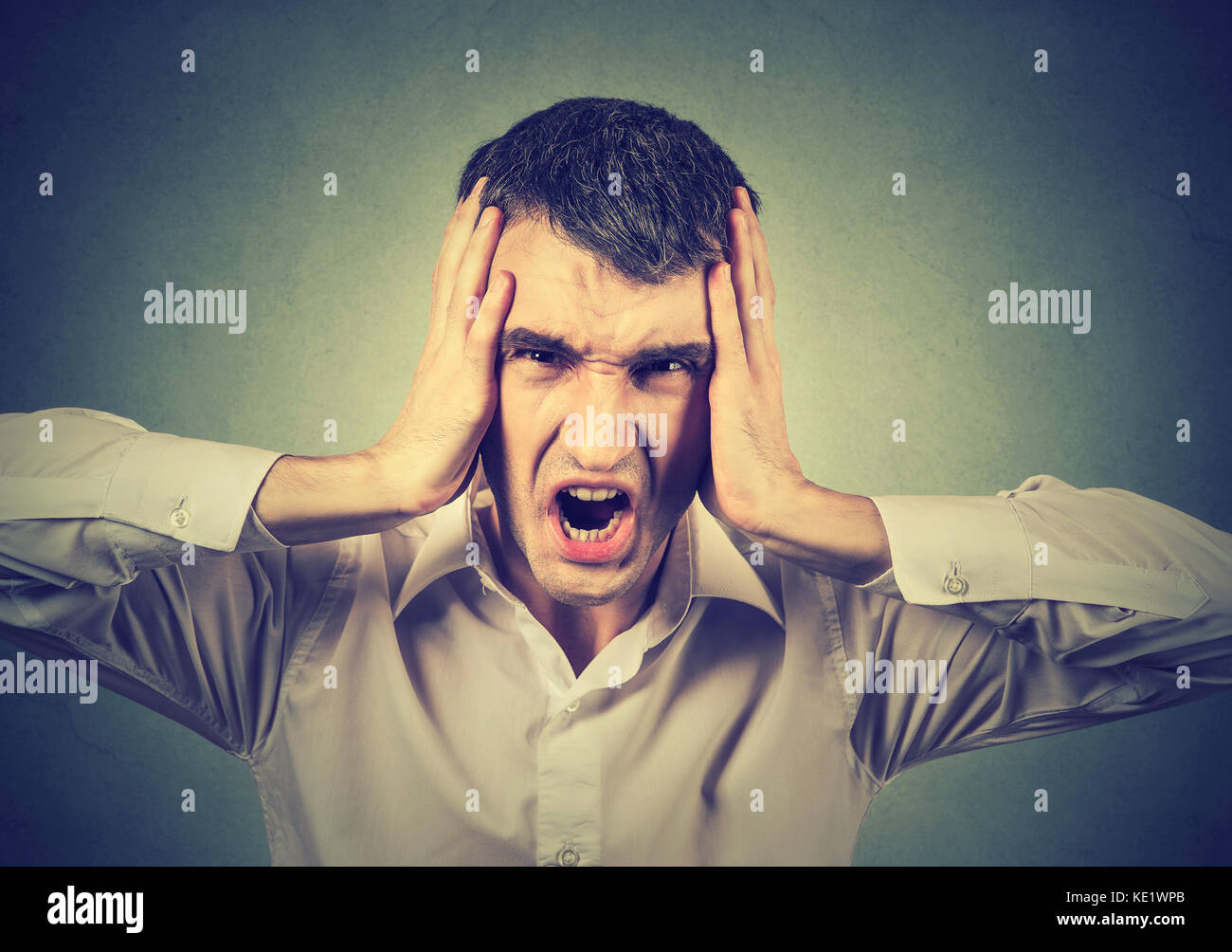 Screaming stressed man Stock Photo - Alamy