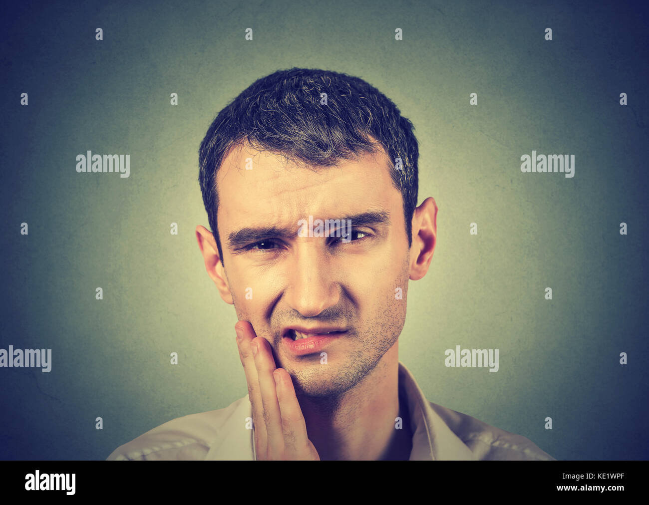 young man with a toothache tooth pain Stock Photo - Alamy