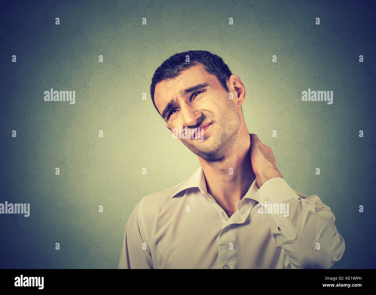 man having neck pain Stock Photo - Alamy