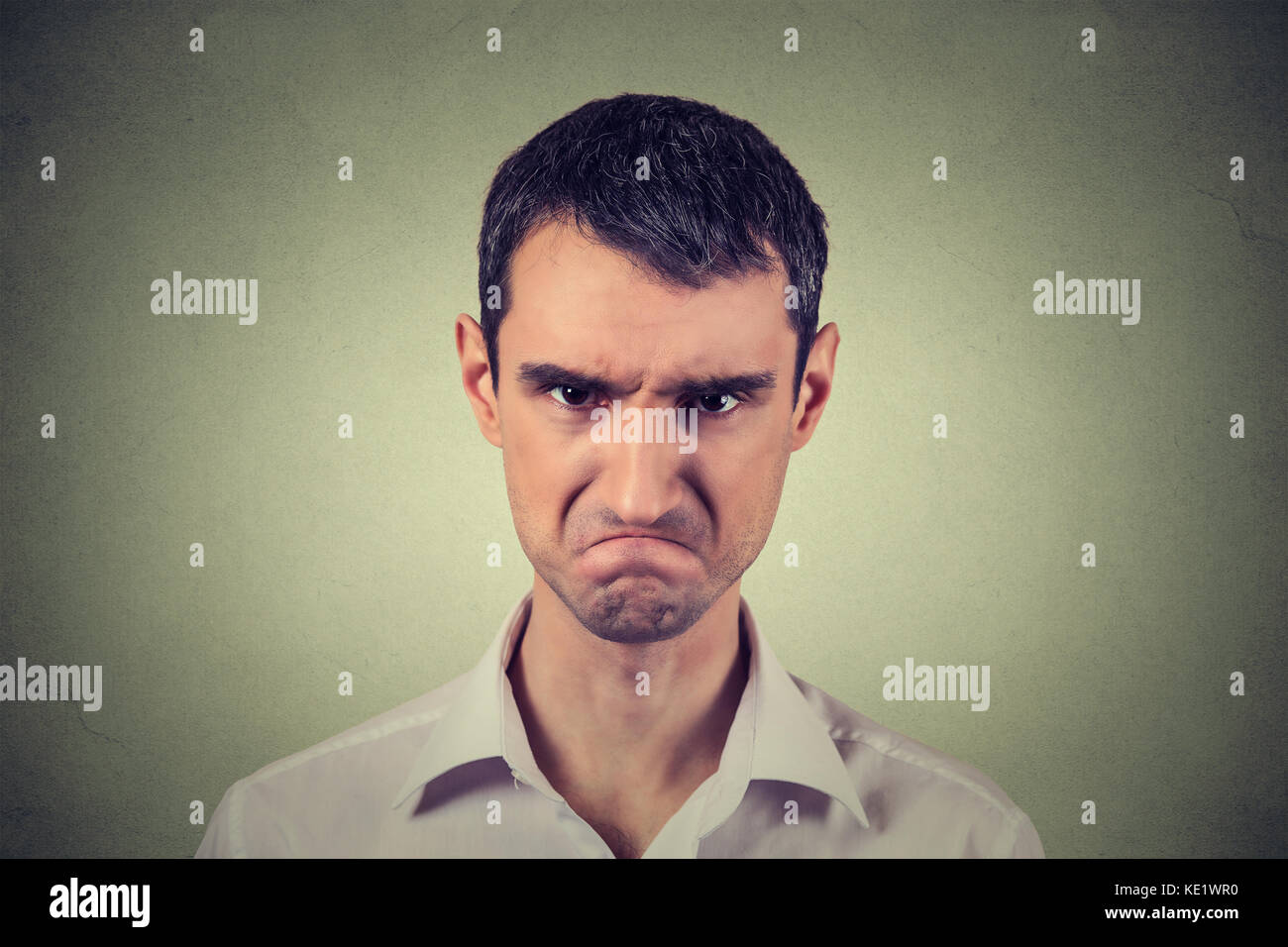 Closeup portrait of angry young man about to have nervous atomic ...