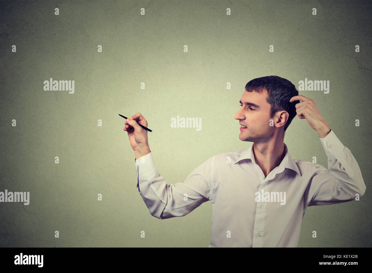 Portrait young creative man drawing, template for illustration on gray ...