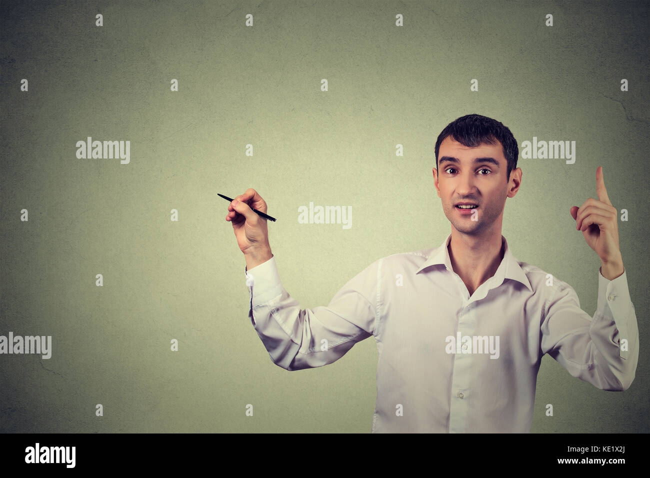 Portrait young creative man drawing, template for illustration on gray ...