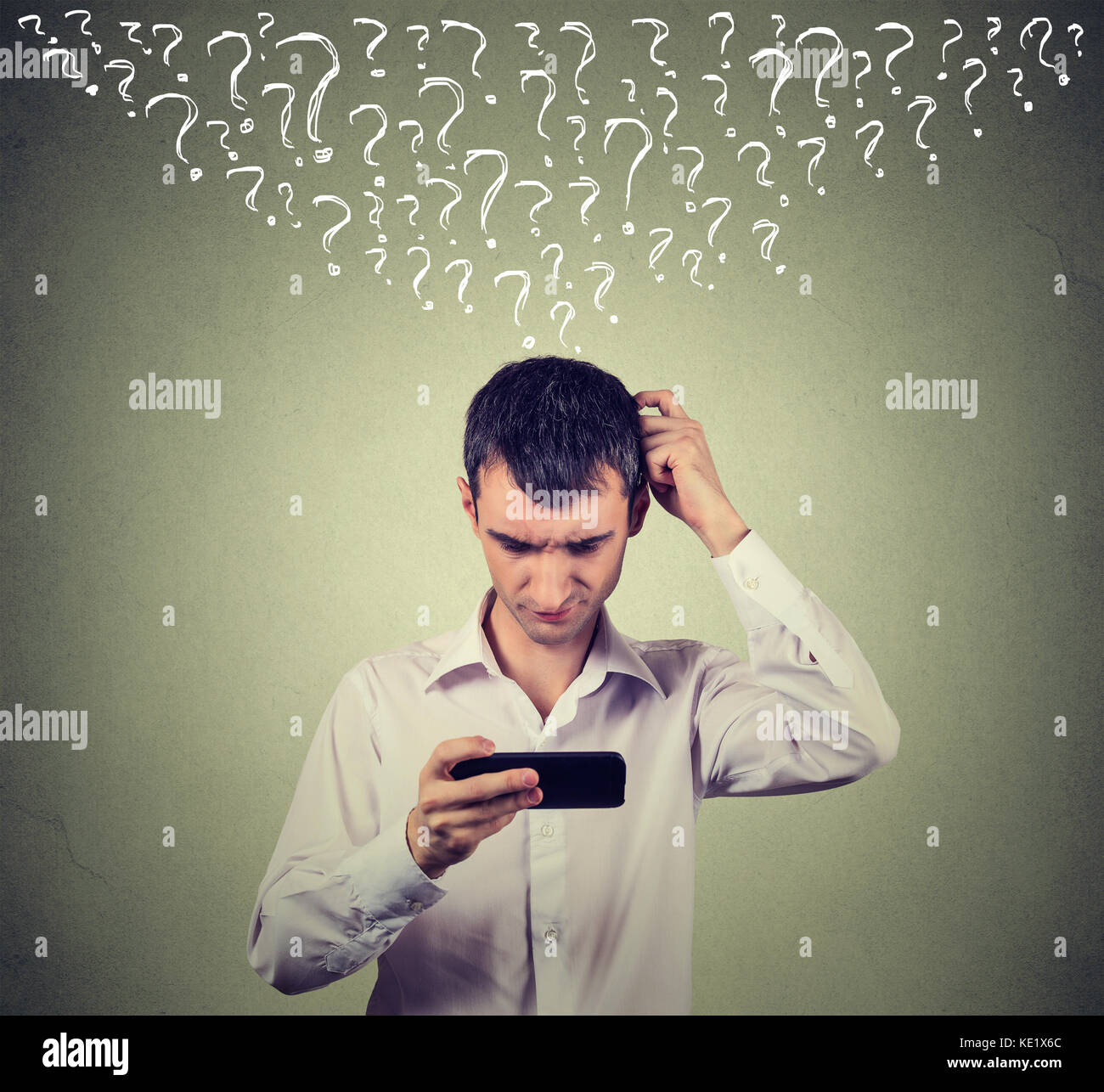 Portrait Confused Young Man Looking At His Mobile Smart Phone Has Many