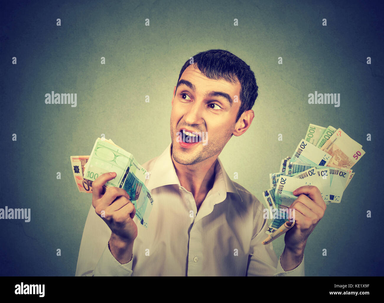 Happy man with money Stock Photo - Alamy