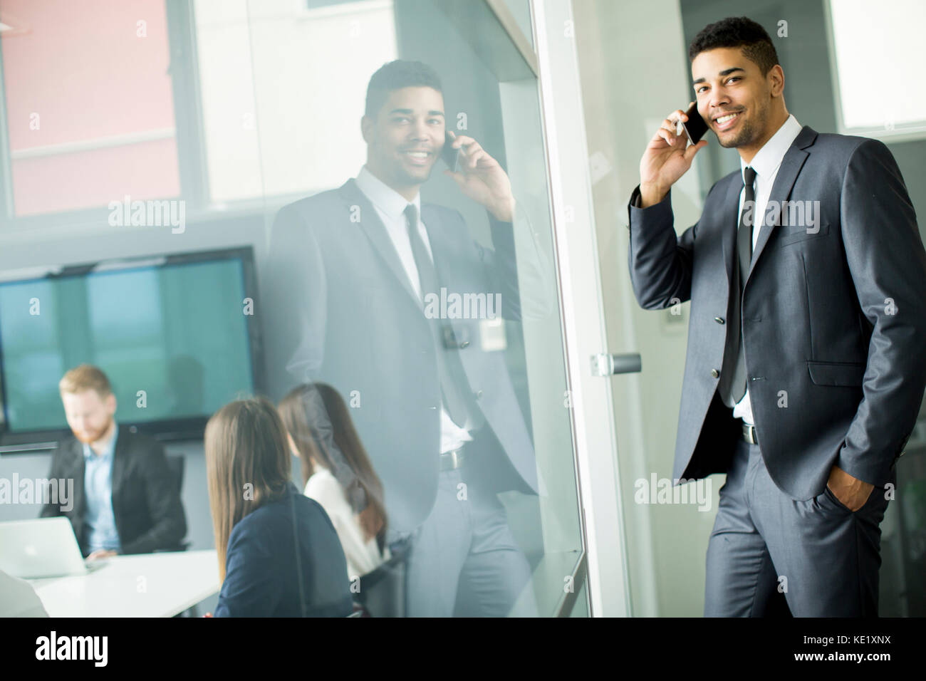 Business team working together in modern office to achieve better ...