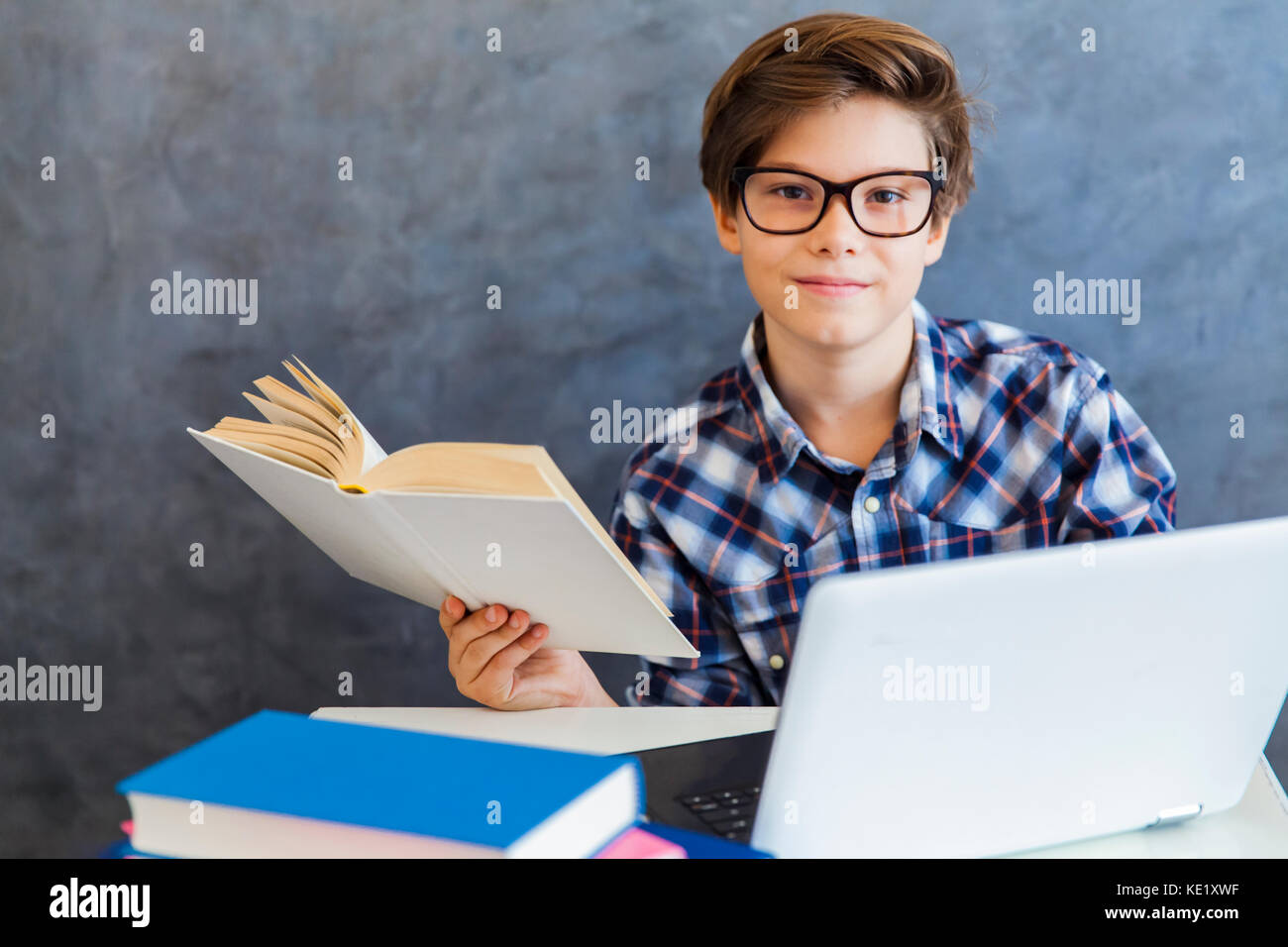 Teen boy reading book hi-res stock photography and images - Alamy