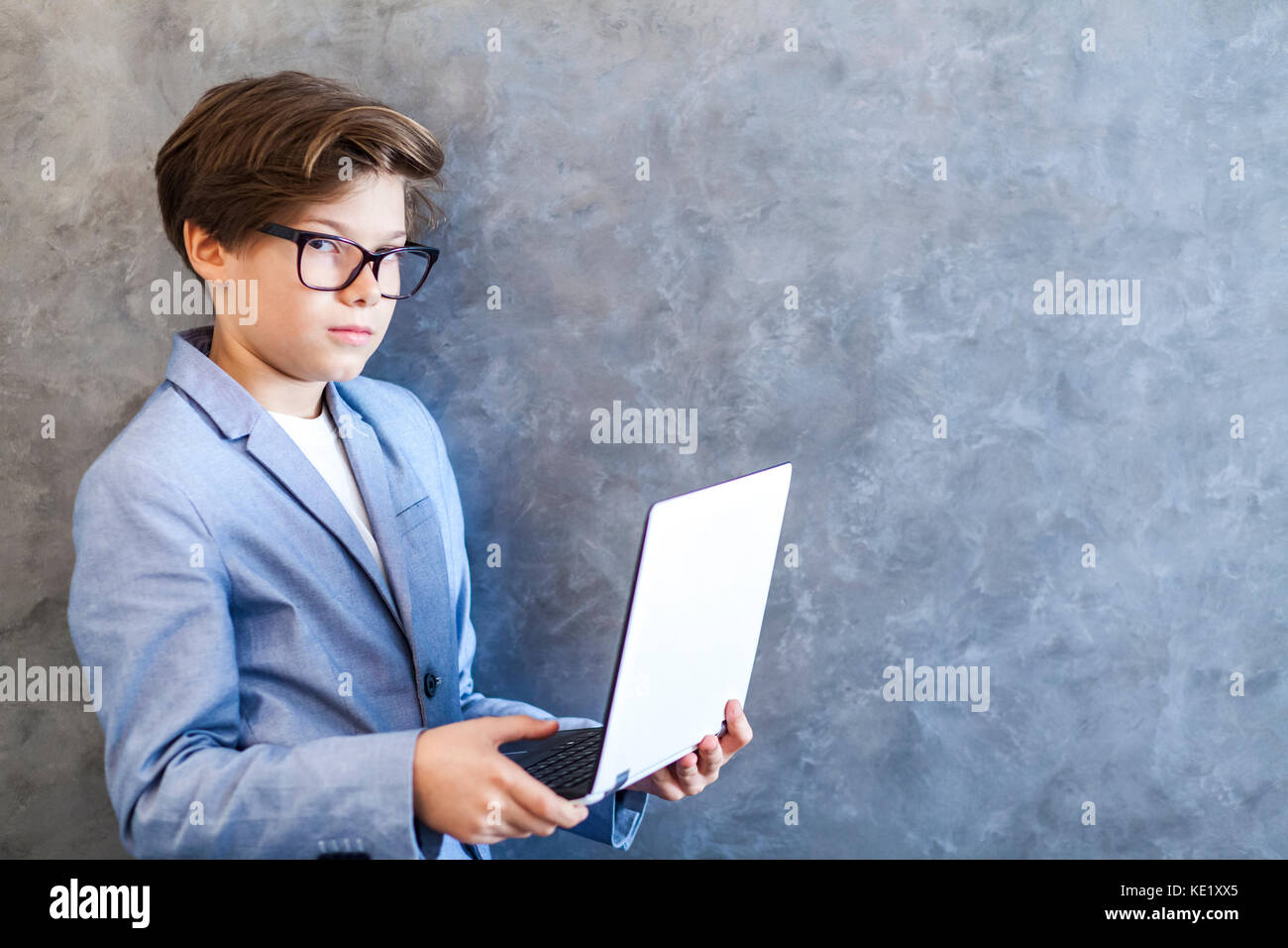 Portrait of teen boy working on laptop Stock Photo - Alamy