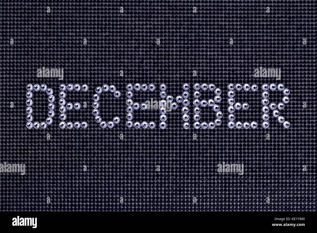 Month DECEMBER is made rhinestones crystal color on a black canvas ...