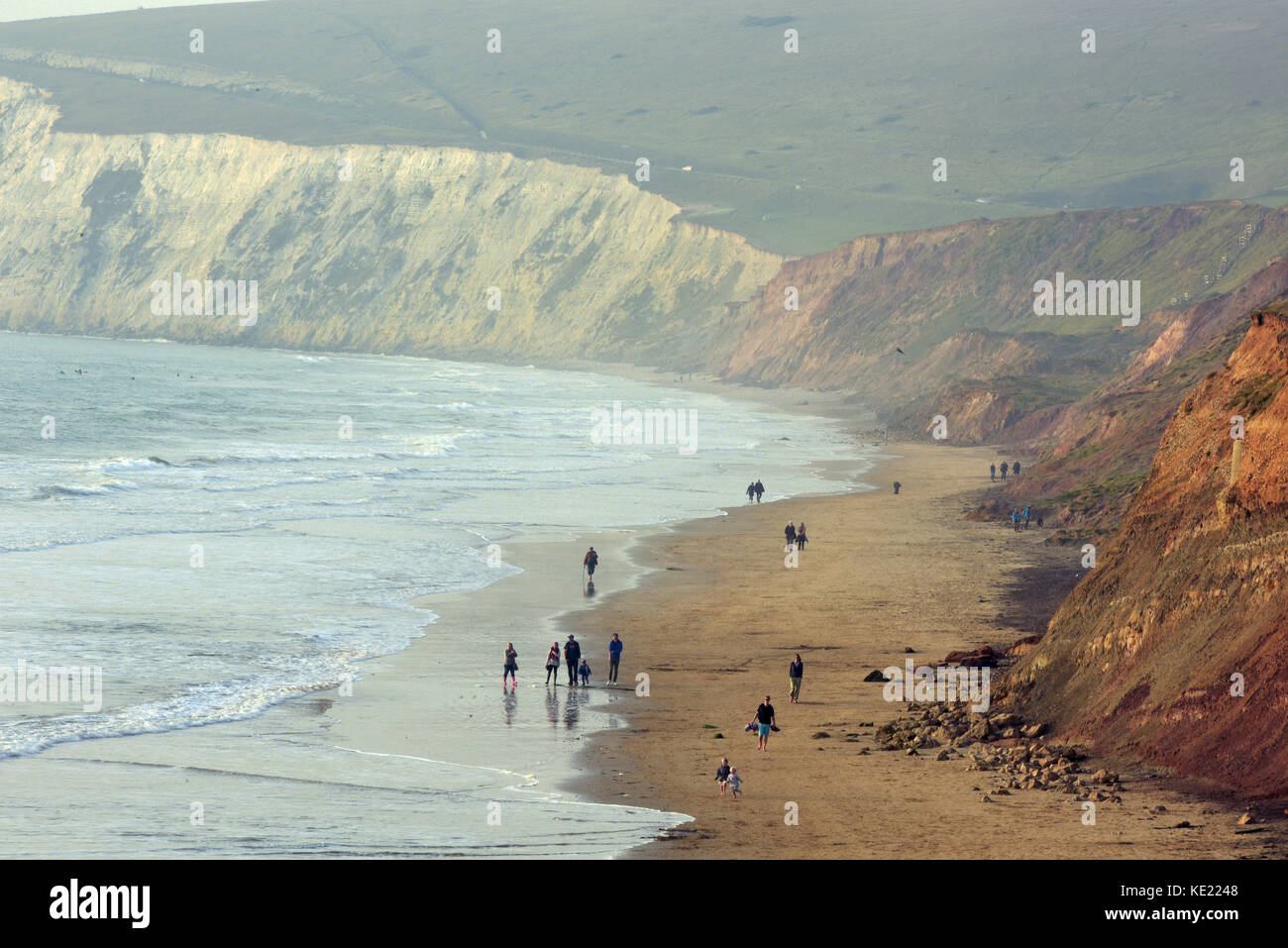 People walking on the beach at Compton bay on the Isle of Wight on a ...