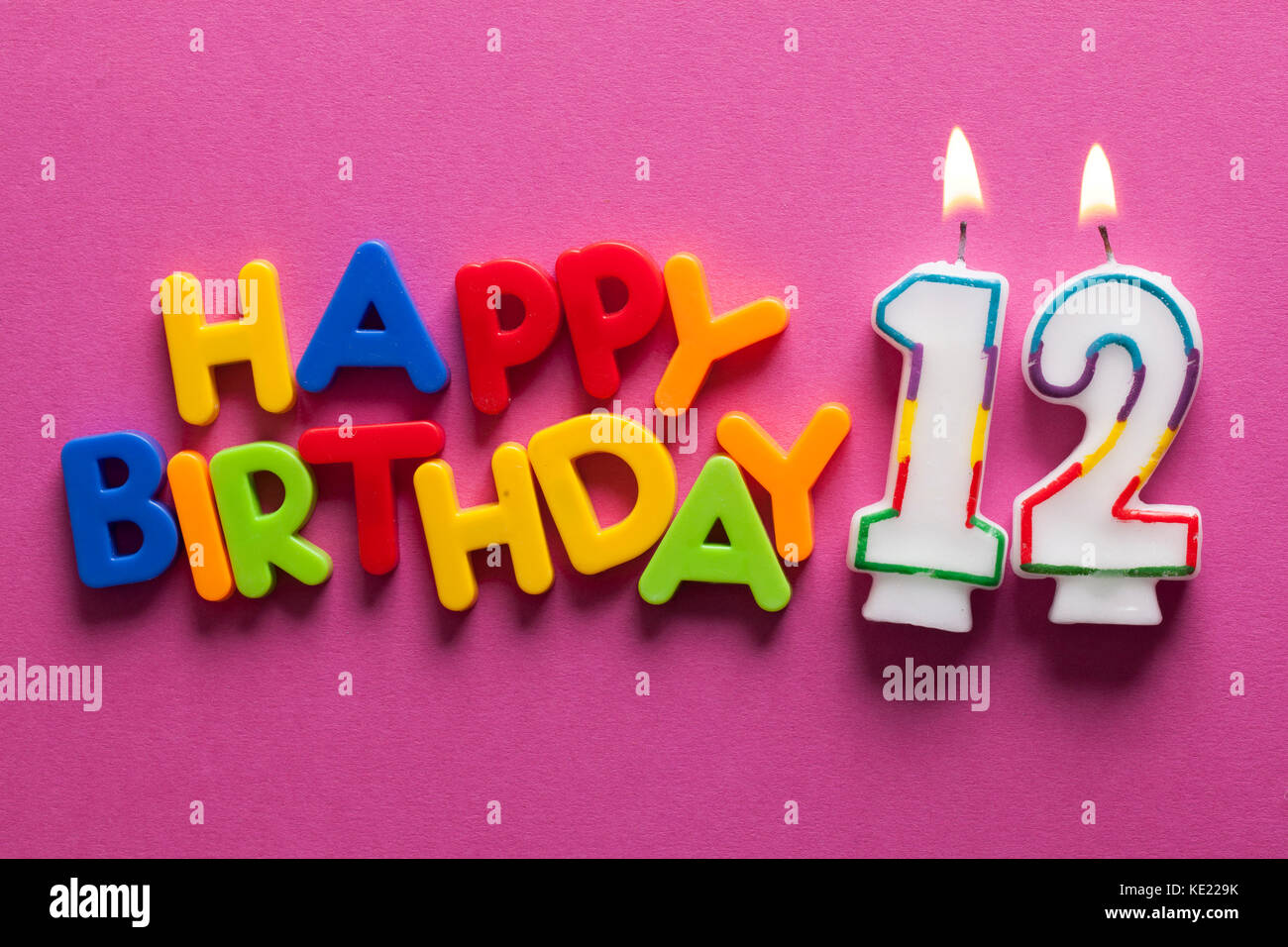 Number 12 happy birthday celebration candle Stock Photo - Alamy