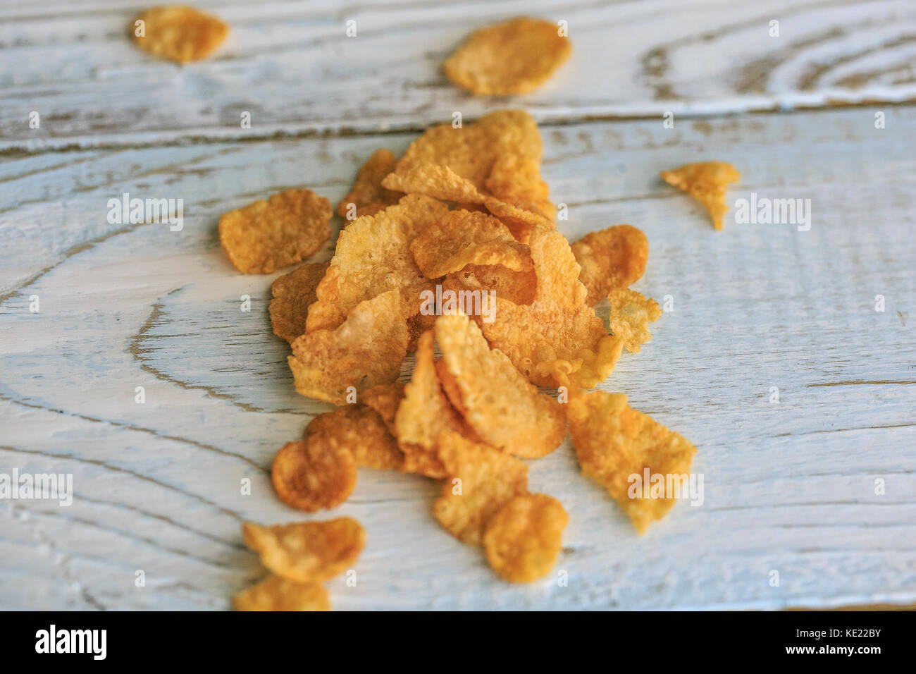 Flakes in a wooden table Stock Photo - Alamy