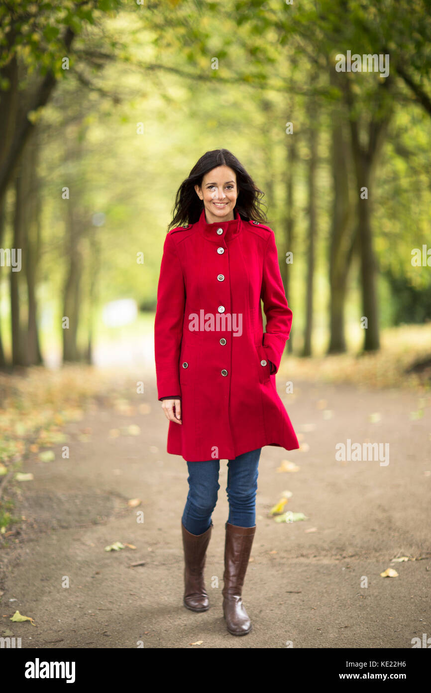 young woman having a walk in the park Stock Photo - Alamy