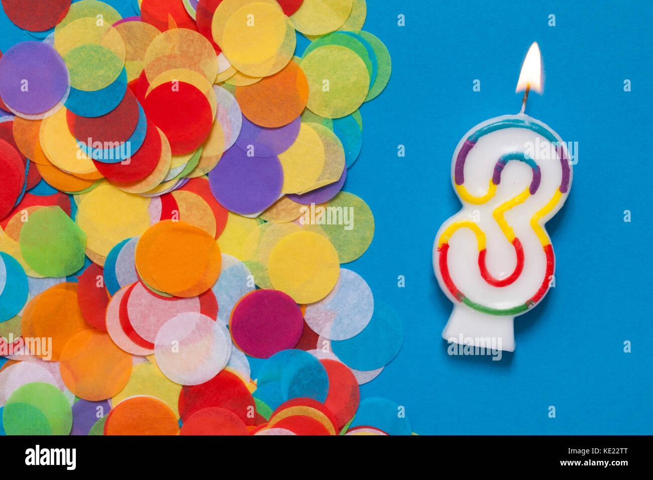 Number 3 celebration candle with party confetti Stock Photo - Alamy