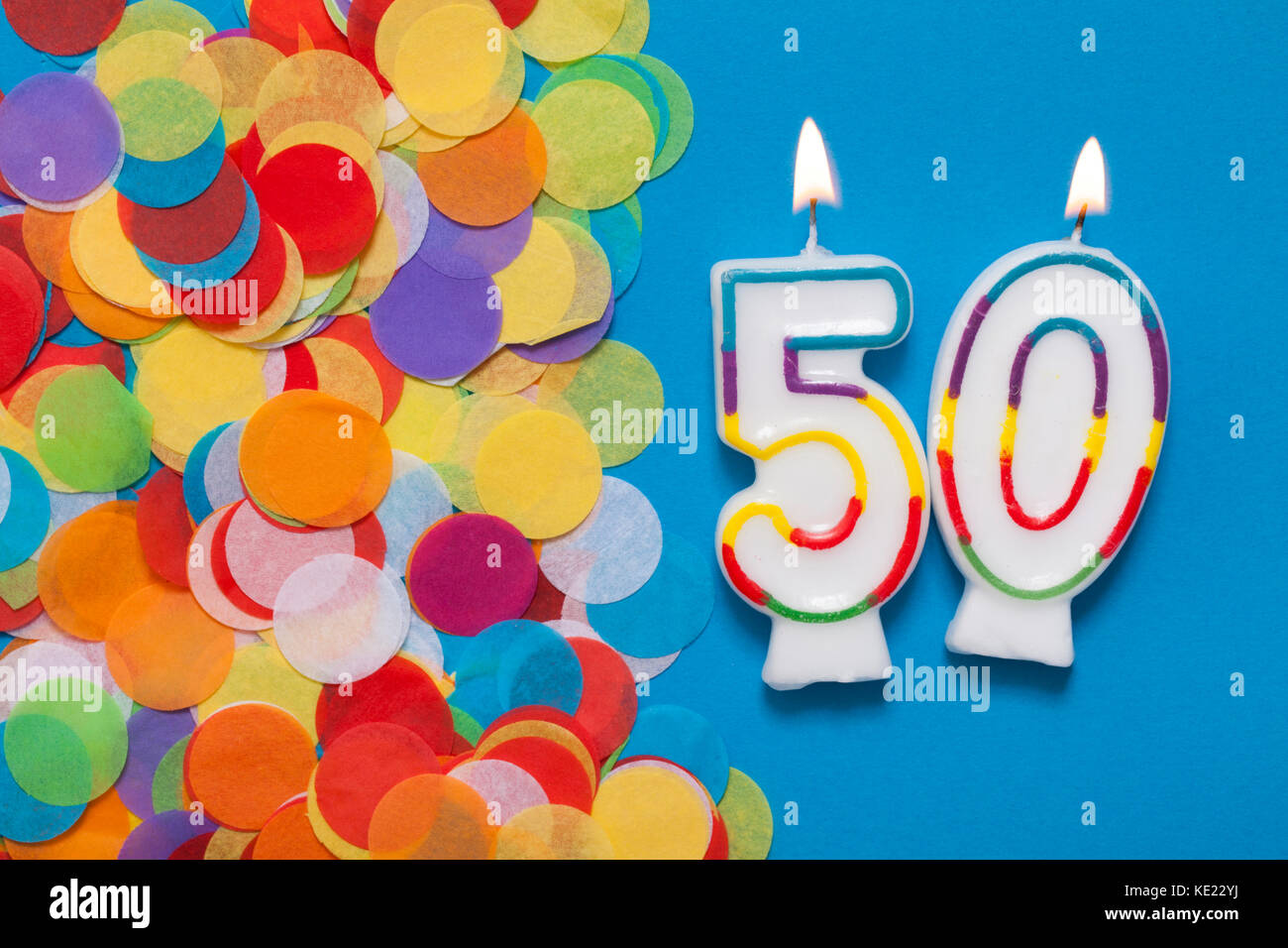 Number 50 celebration candle with party confetti Stock Photo - Alamy