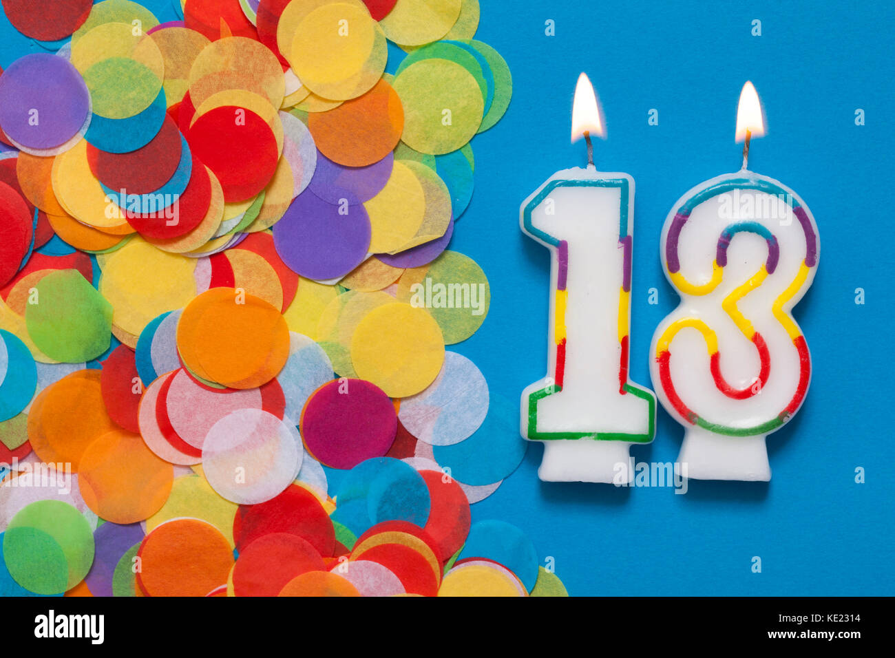 Number 13 celebration candle with party confetti Stock Photo - Alamy